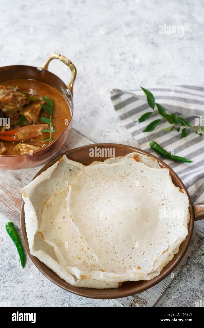 Kerala Appam and crab curry, selective focus Stock Photo - Alamy