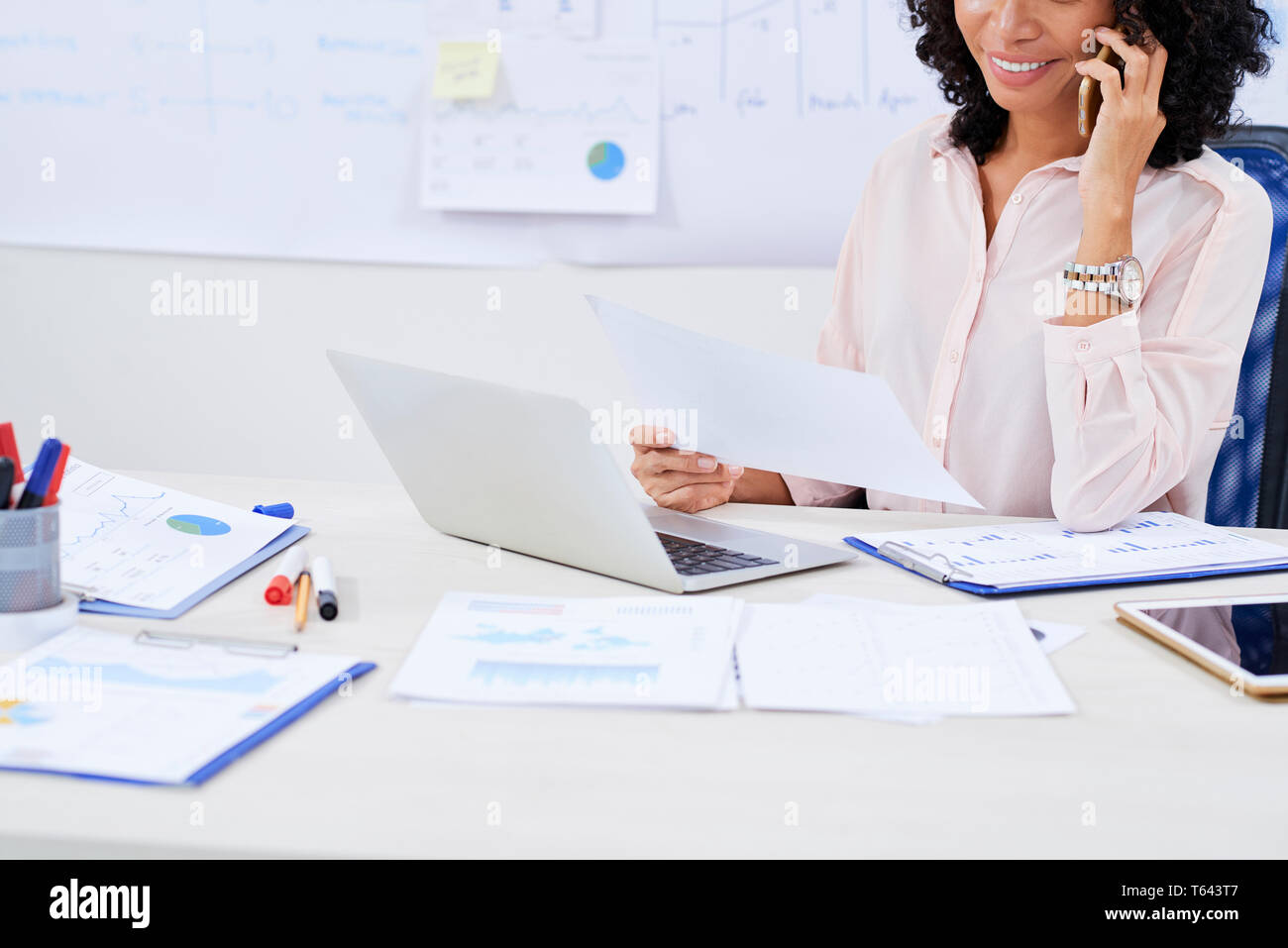 Businesswoman making smartphone call checking hi-res stock photography ...