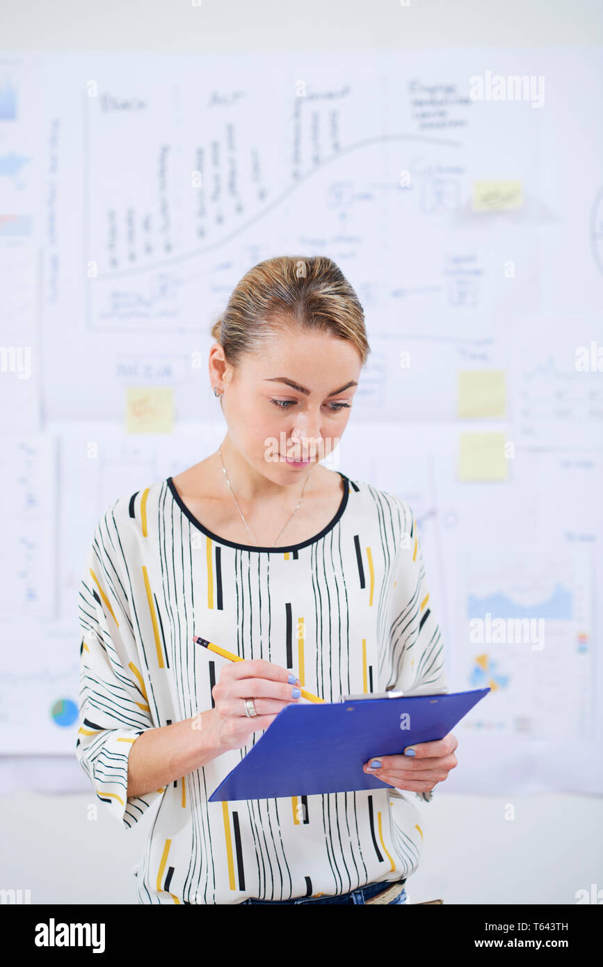 Female business writing reading hi-res stock photography and images - Alamy