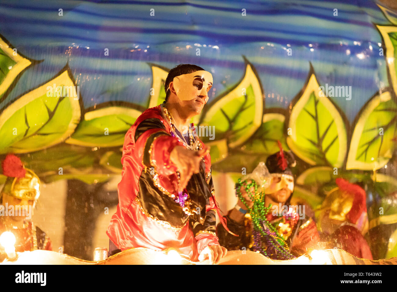 Man throwing mardi gras beads hi-res stock photography and images - Alamy