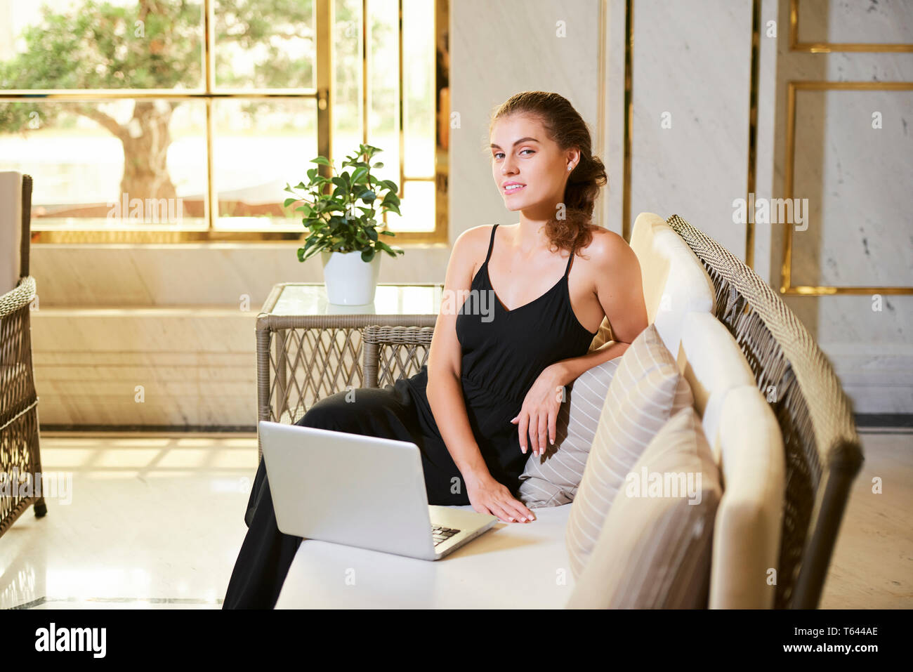 Woman sitting luxury home hi-res stock photography and images - Alamy