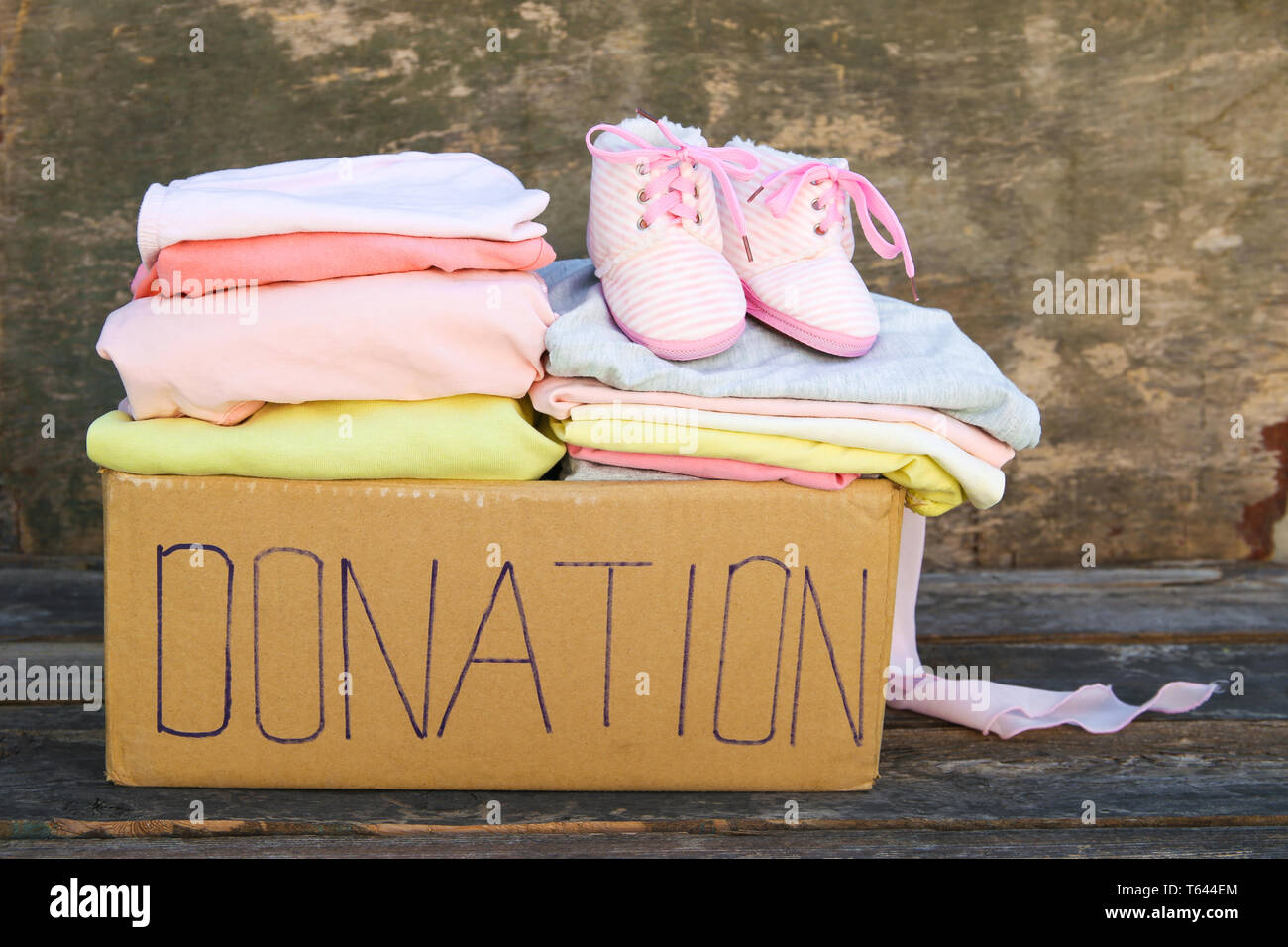Donation box clothes on wooden hi-res stock photography and images - Alamy