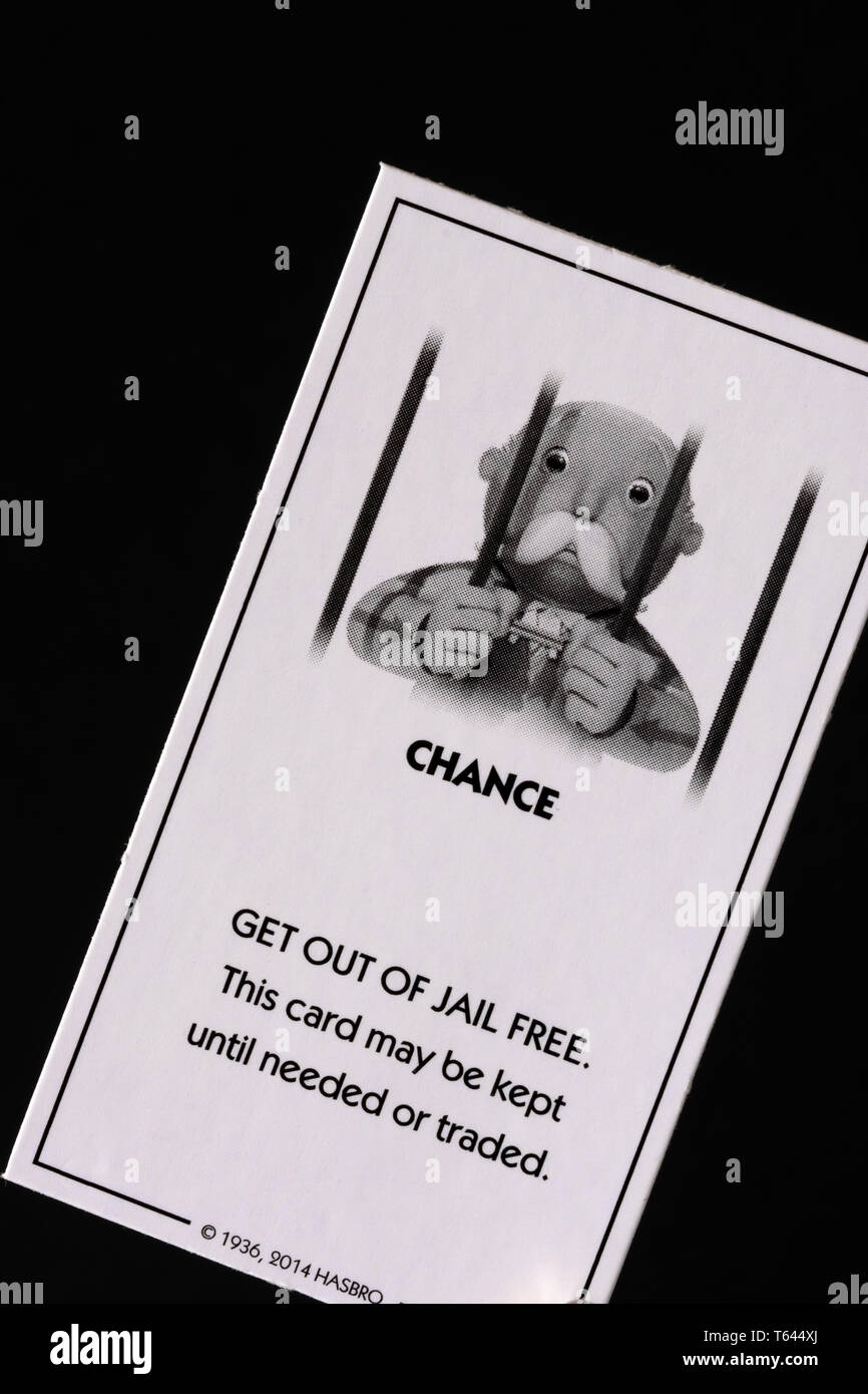 Get out of Jail Free Card from Hasbro's Monopoly, against a black ...