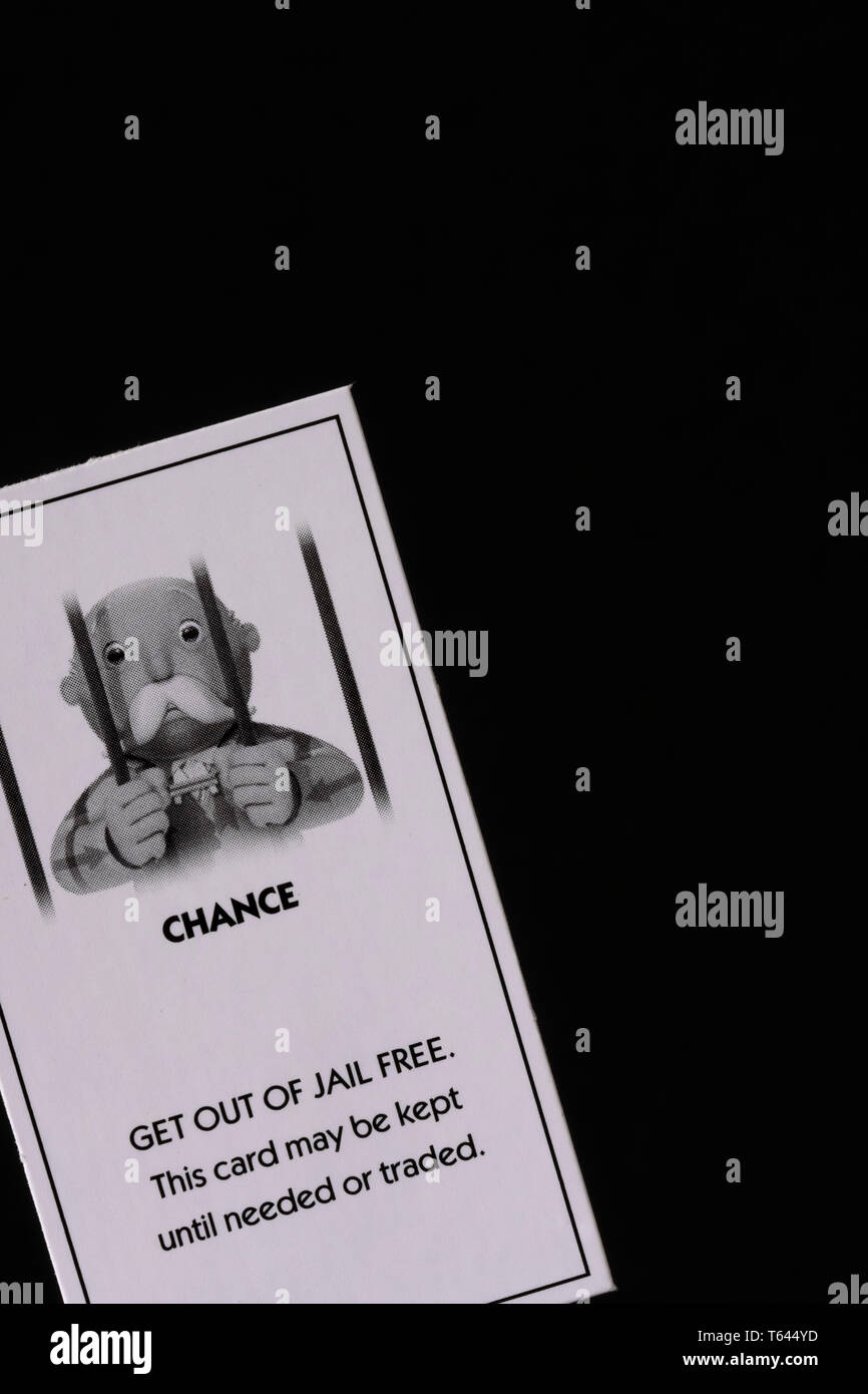 Get out of Jail Free Card from Hasbro's Monopoly, against a black ...