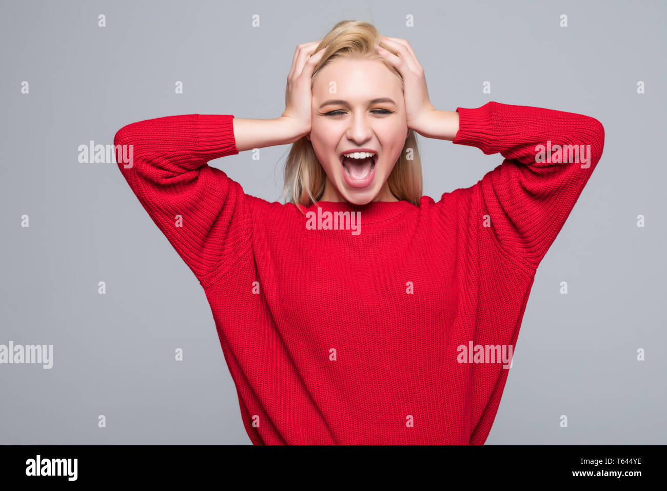 Young pretty blonde girl shouting aloud isolated on white Stock Photo ...