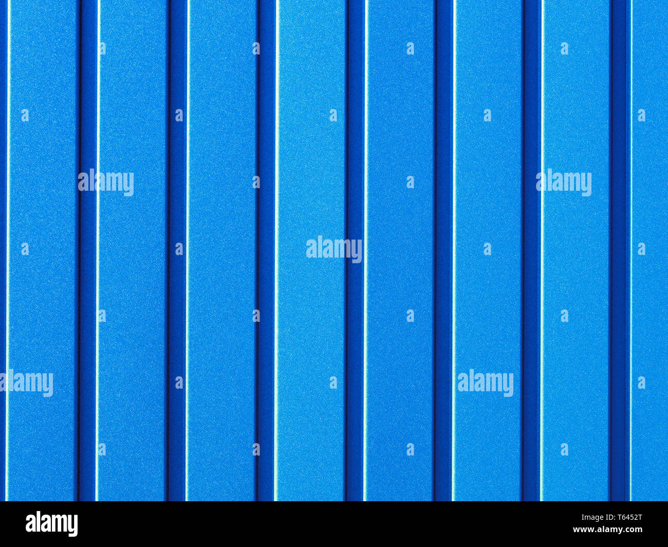 Light blue metallic fence made of corrugated steel sheet with vertical ...