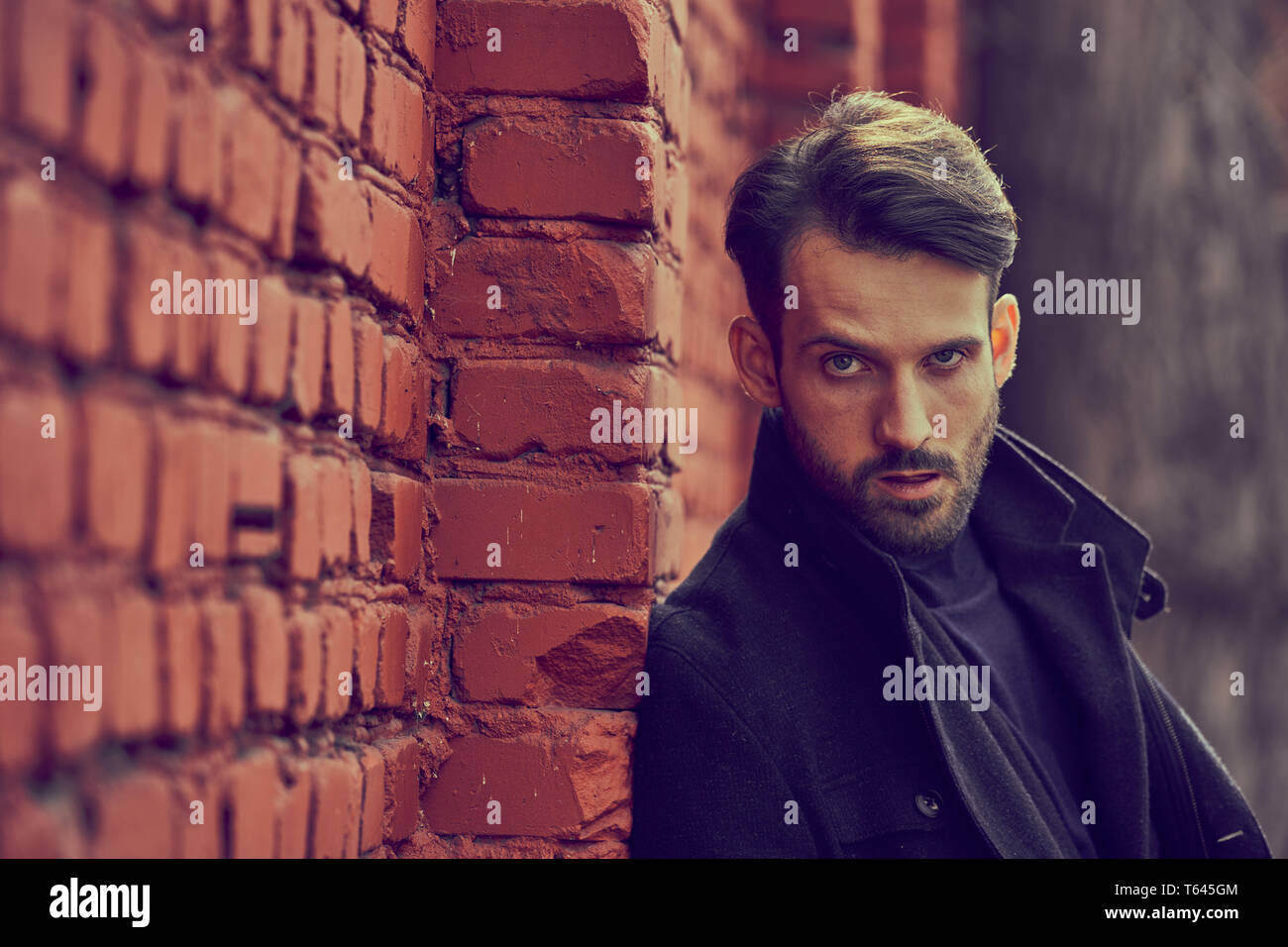 Angry beard bandit male looking serious outdoor on brick wall ...