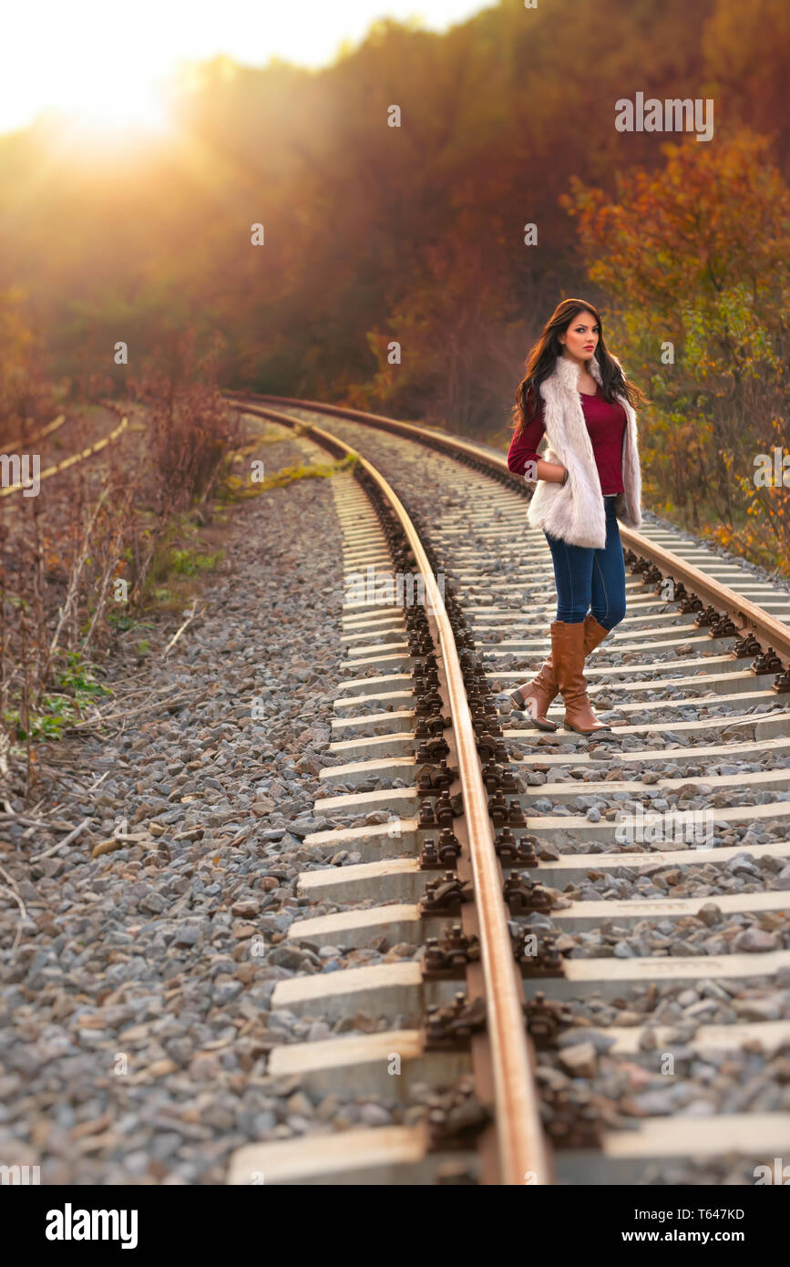 Woman sitting on railroad tracks hi-res stock photography and images ...