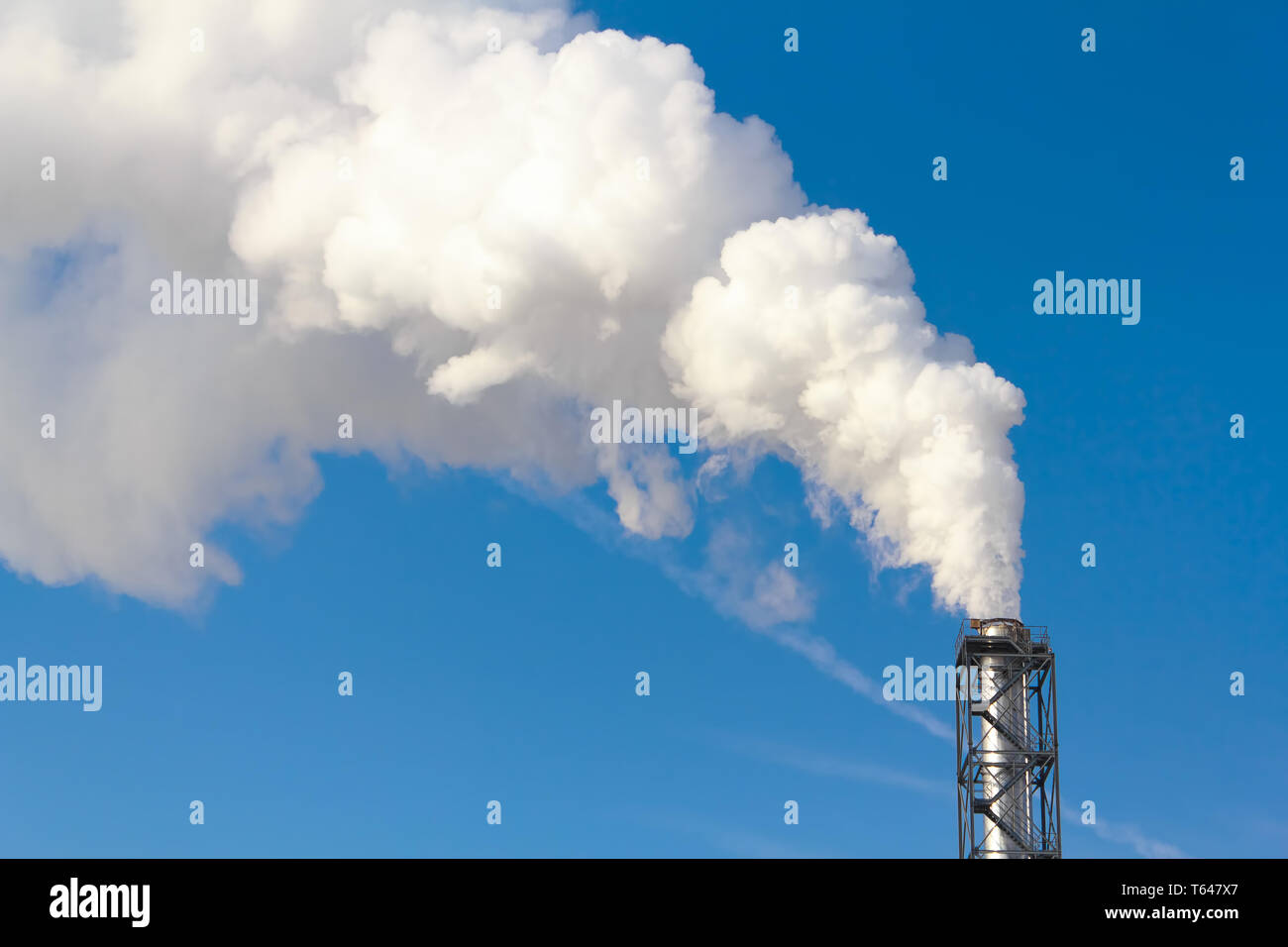 Polluting white smoke coming out of chimney Stock Photo - Alamy