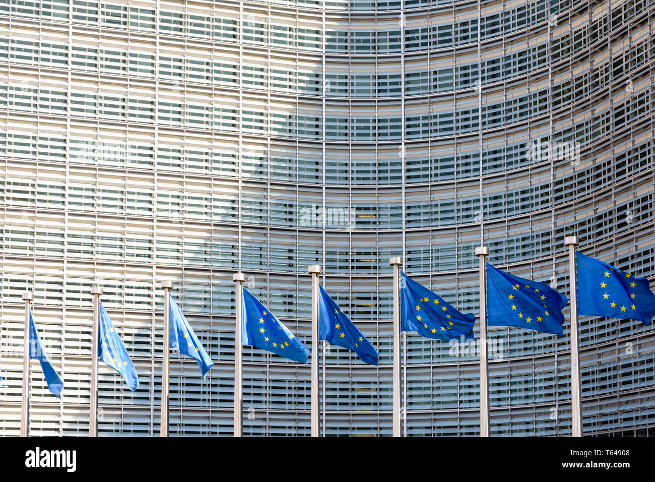 A row of european flags blowing in the wind in front of the Berlaymont ...
