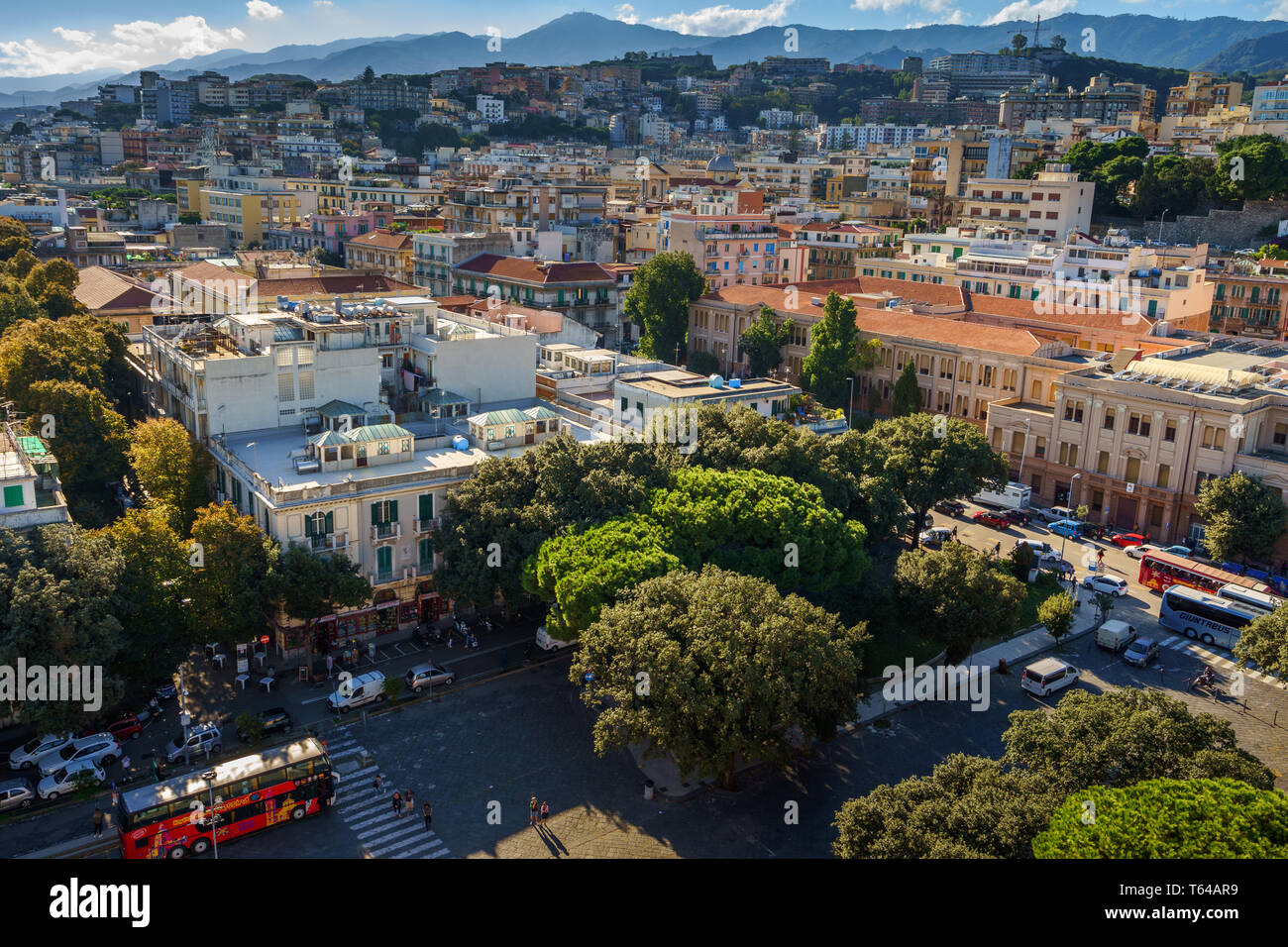 Panoramic top view of the local buildings with the trees, mountains and ...