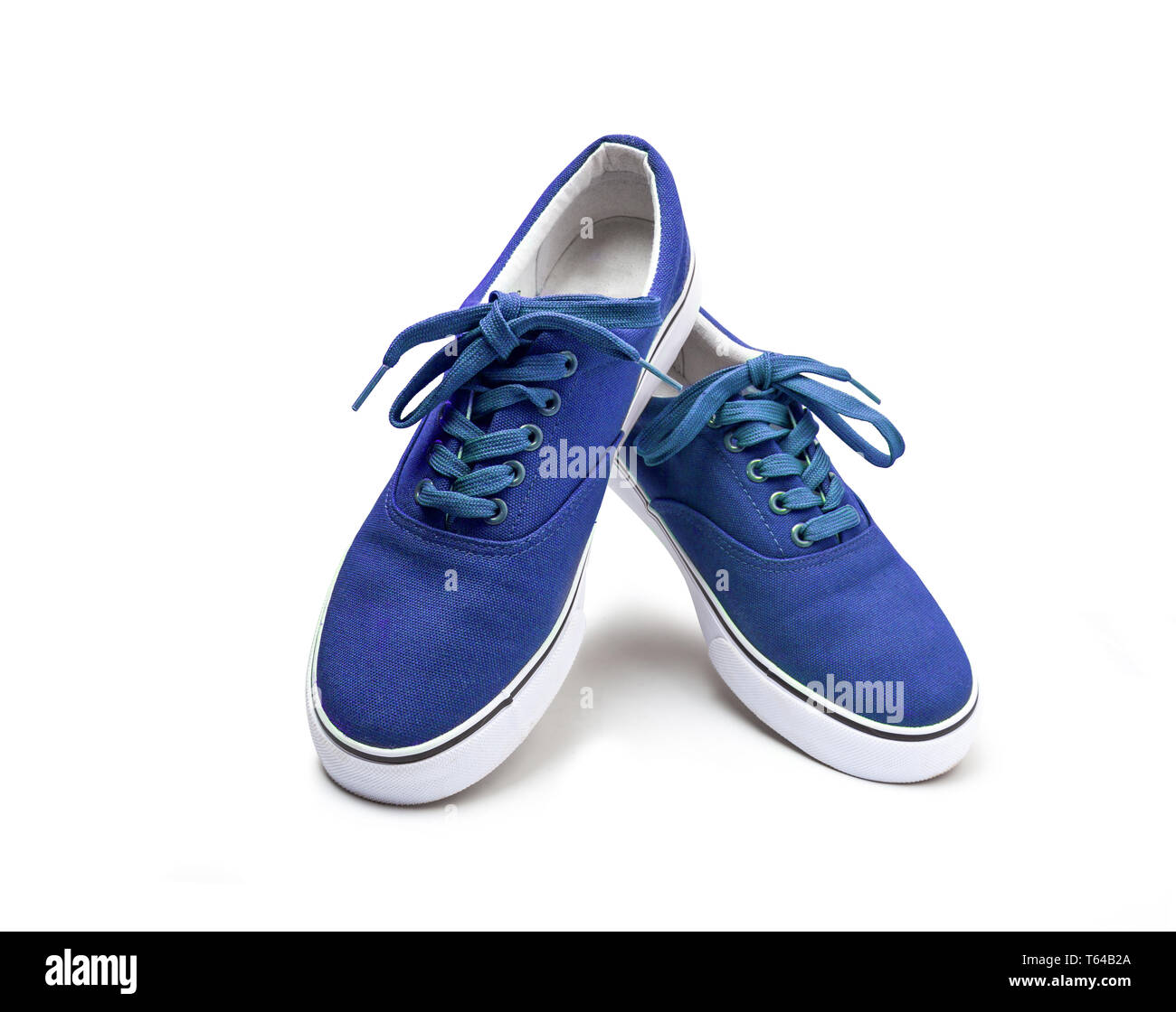 A pair of blue color canvas shoes isolated on white background with ...