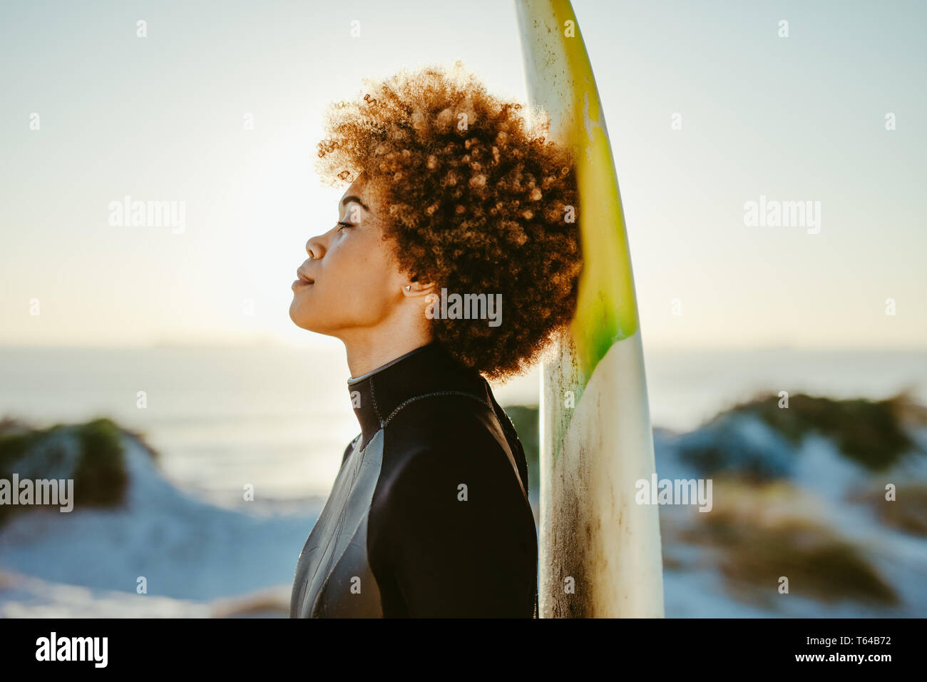 Surfer girl relaxing on surfboard hi-res stock photography and images ...