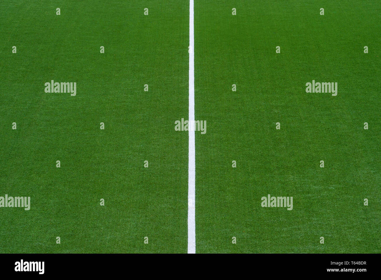 Artificial green turf texture background with white line marks Stock ...