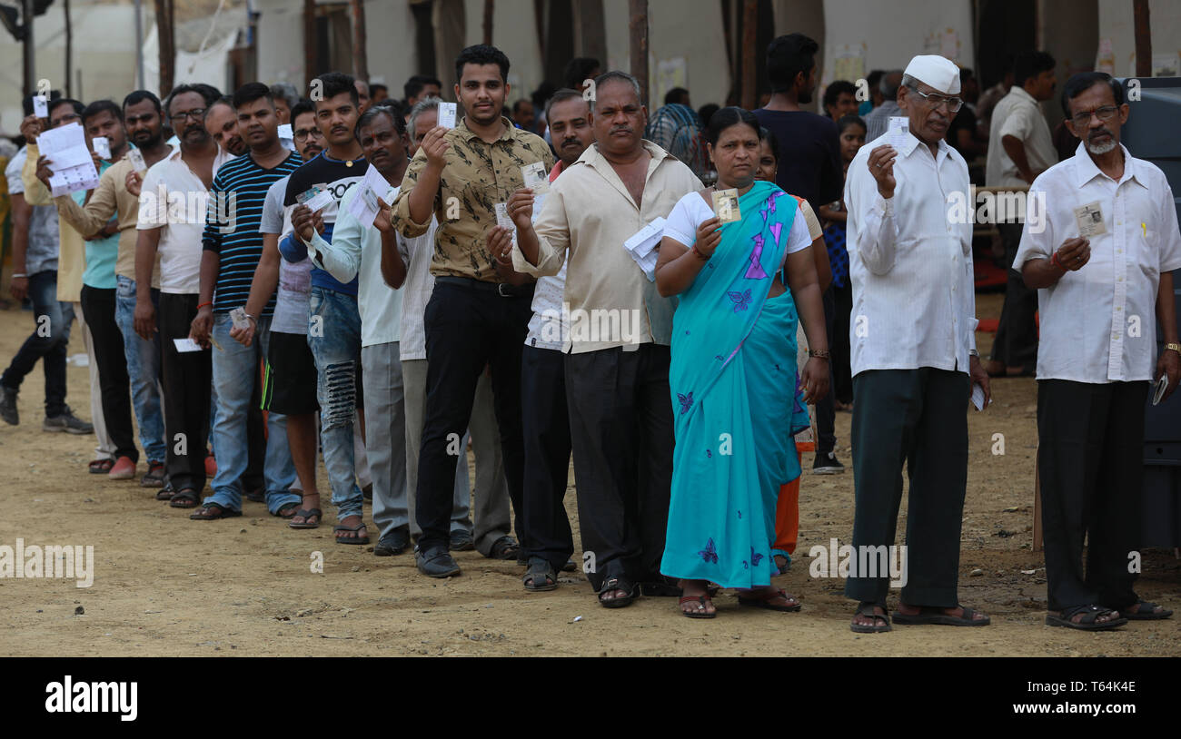 Mumbai, India. 29th Apr, 2019. Indian voters stand in a queue to cast ...