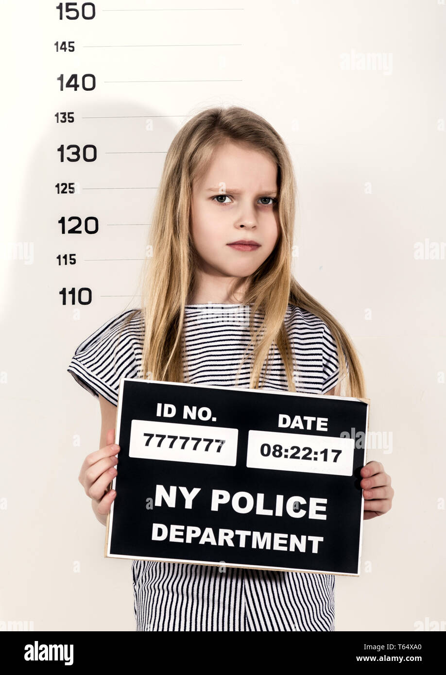Young beautiful blonde child with a sign, Criminal Mug Shots. difficult ...