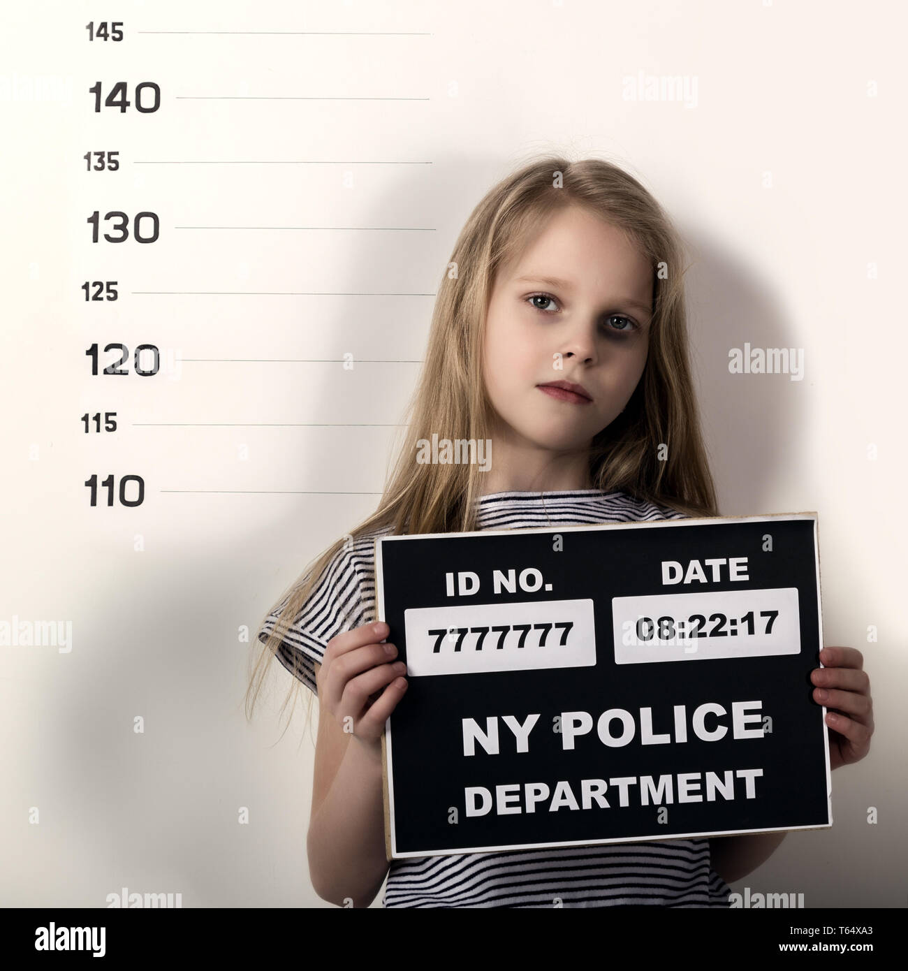 Young beautiful blonde child with a sign, Criminal Mug Shots. difficult ...