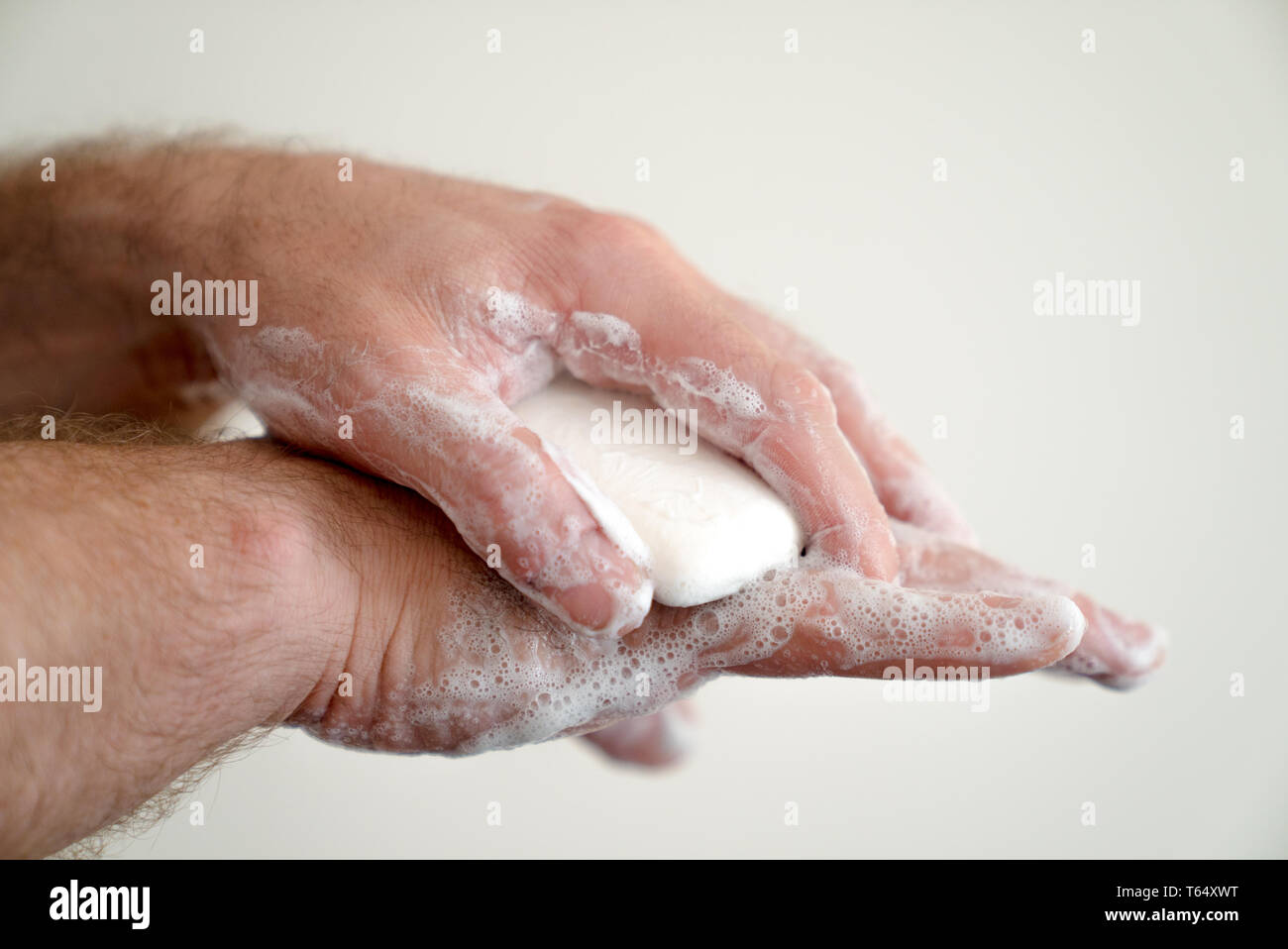 Two soapy hands hi-res stock photography and images - Alamy