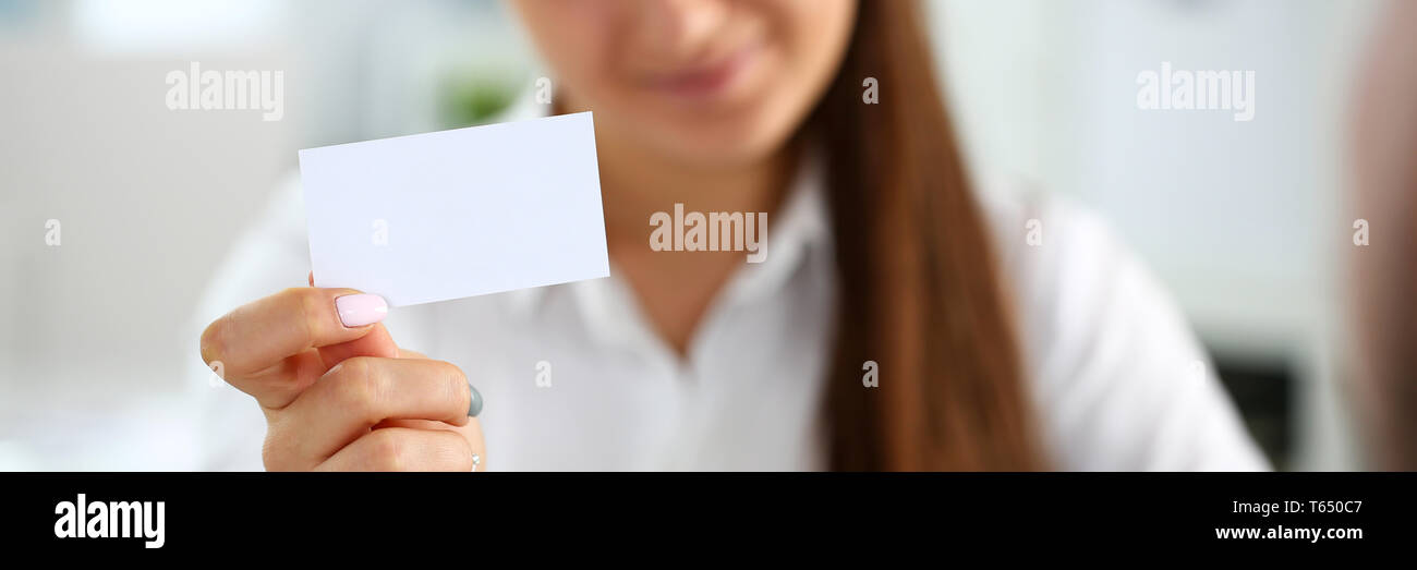 Female arm in suit give blank calling card to visitor Stock Photo - Alamy