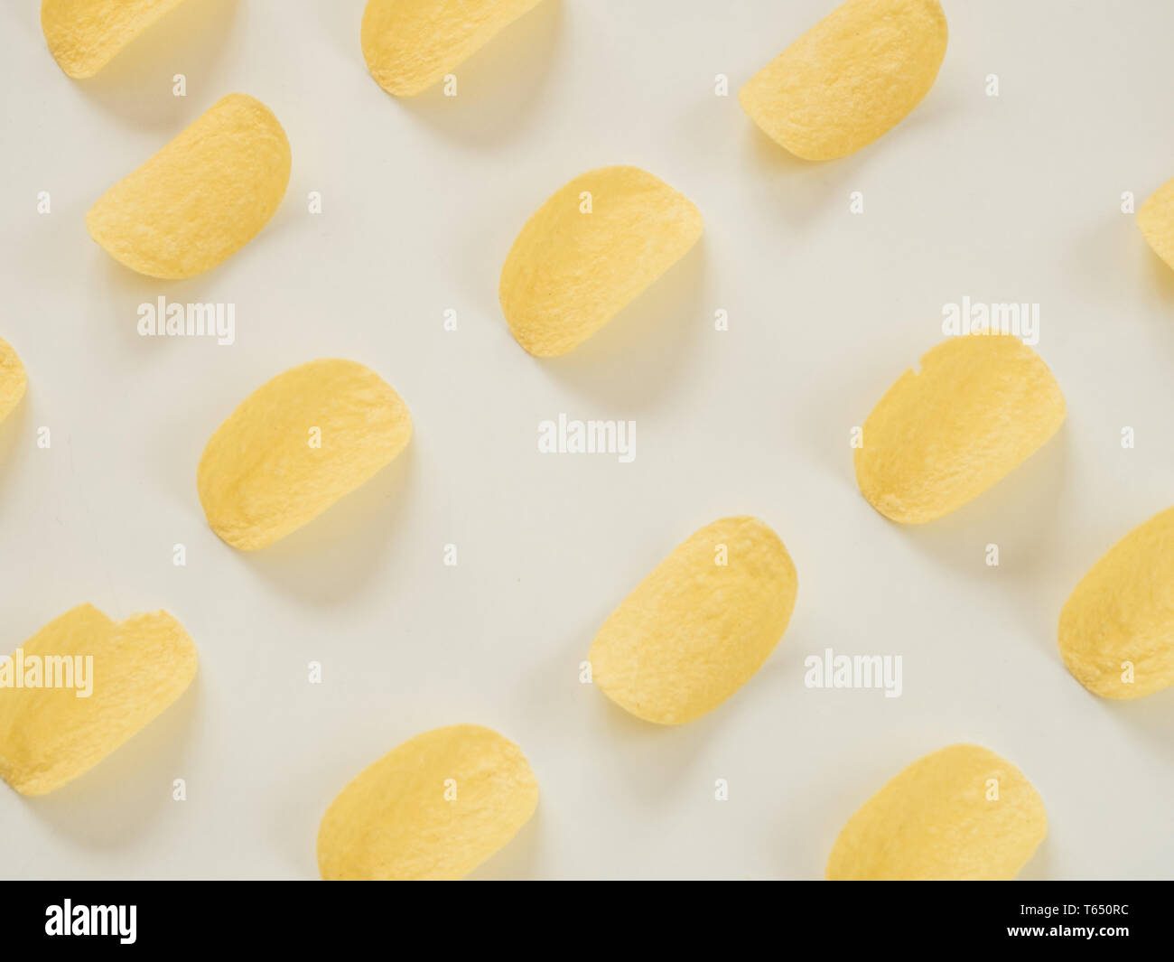 Potato chips pattern on white background Stock Photo - Alamy