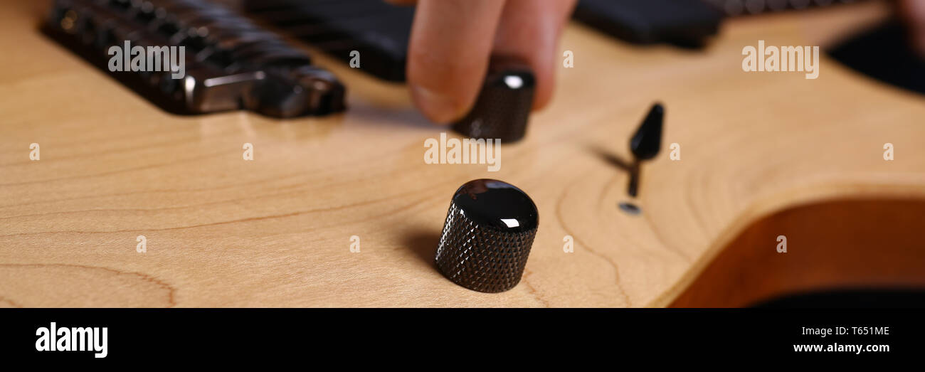 Male arms playing classic shape electric guitar Stock Photo - Alamy