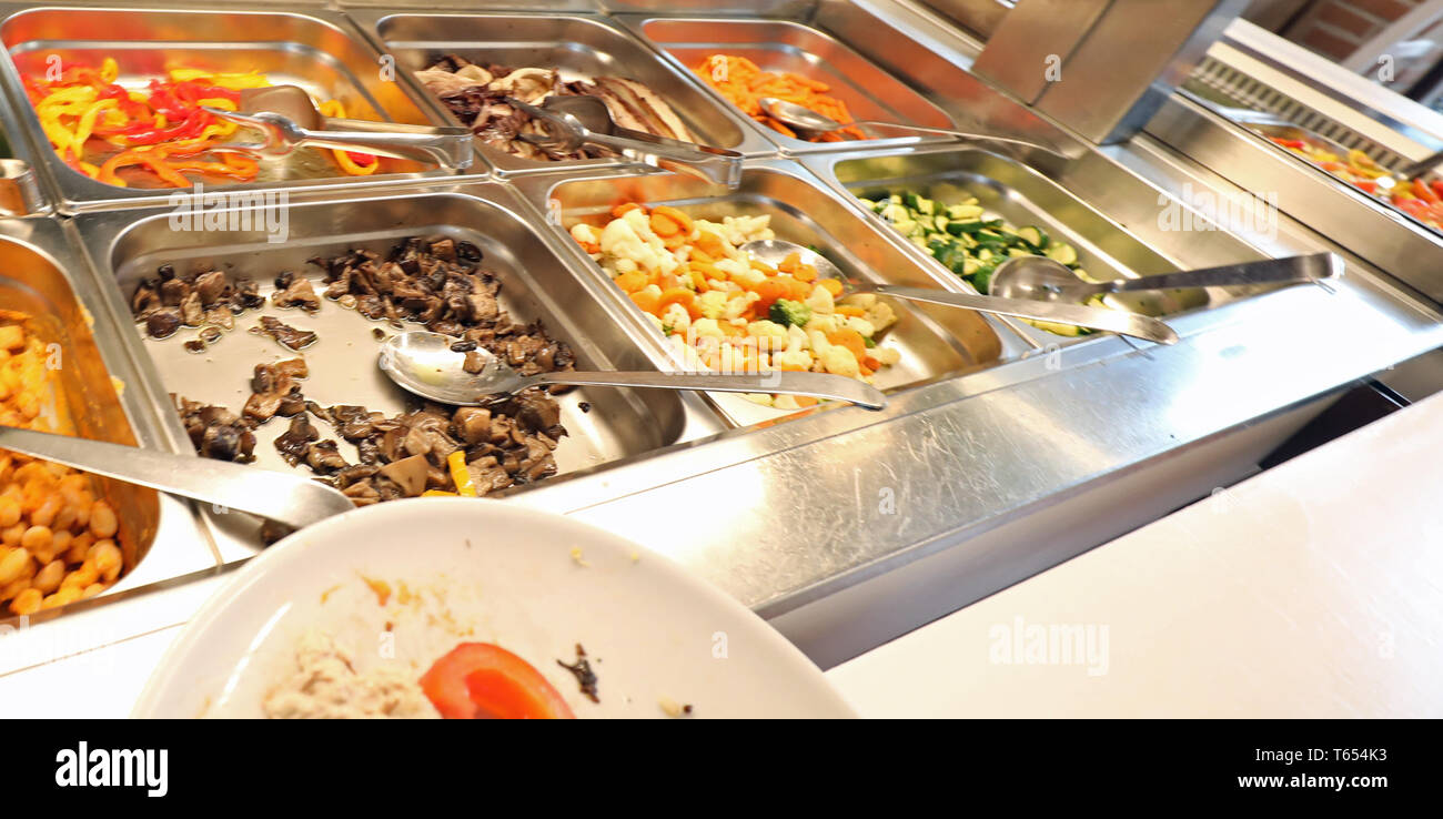 Inside a self service restaurant with many raw and cooked foods Stock ...