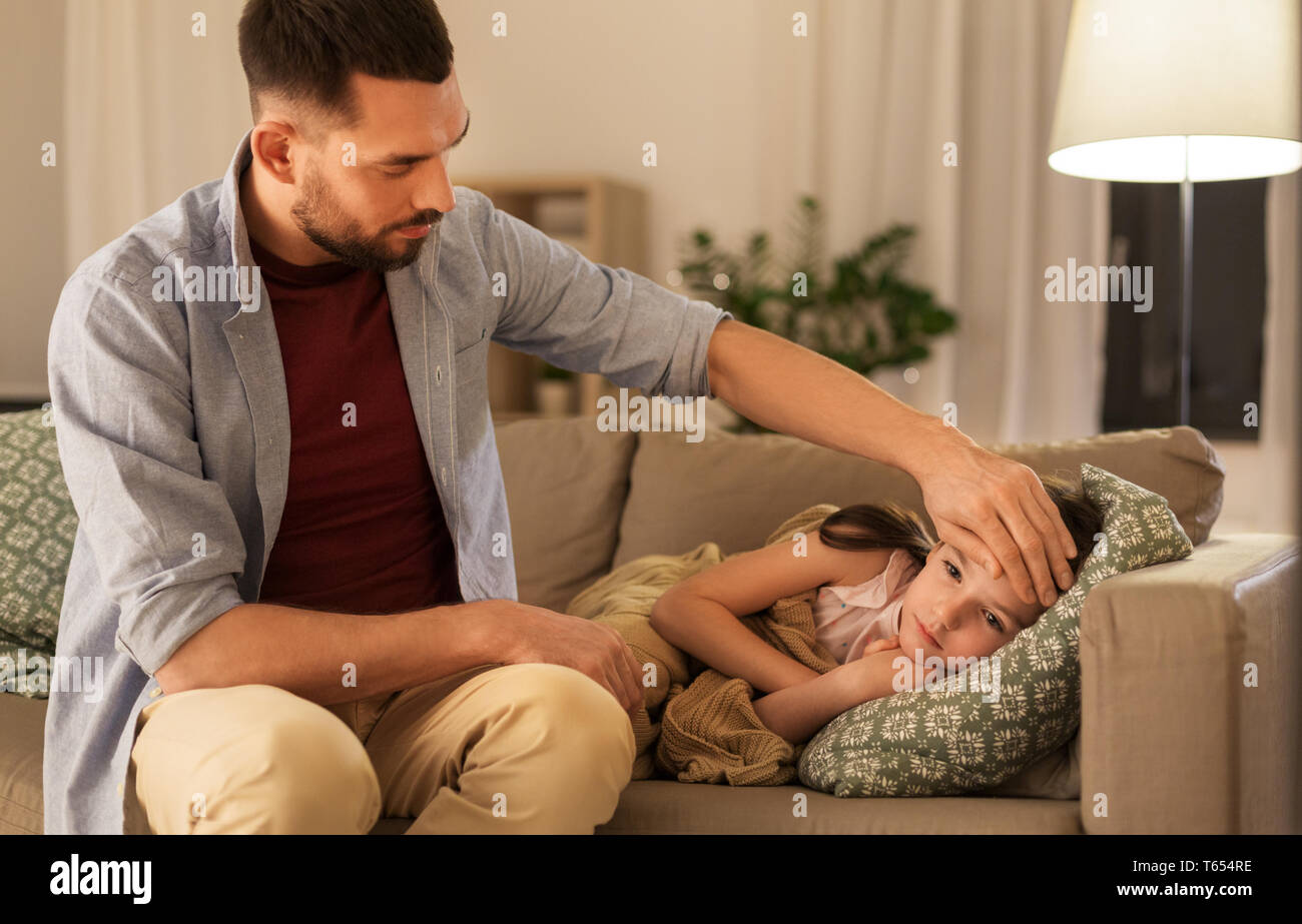 father taking care of ill daughter at home Stock Photo - Alamy