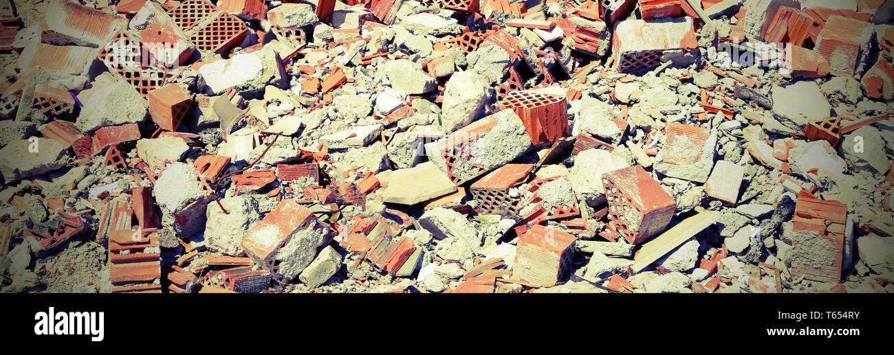 background of rubble with many broken bricks and cement with old toned ...