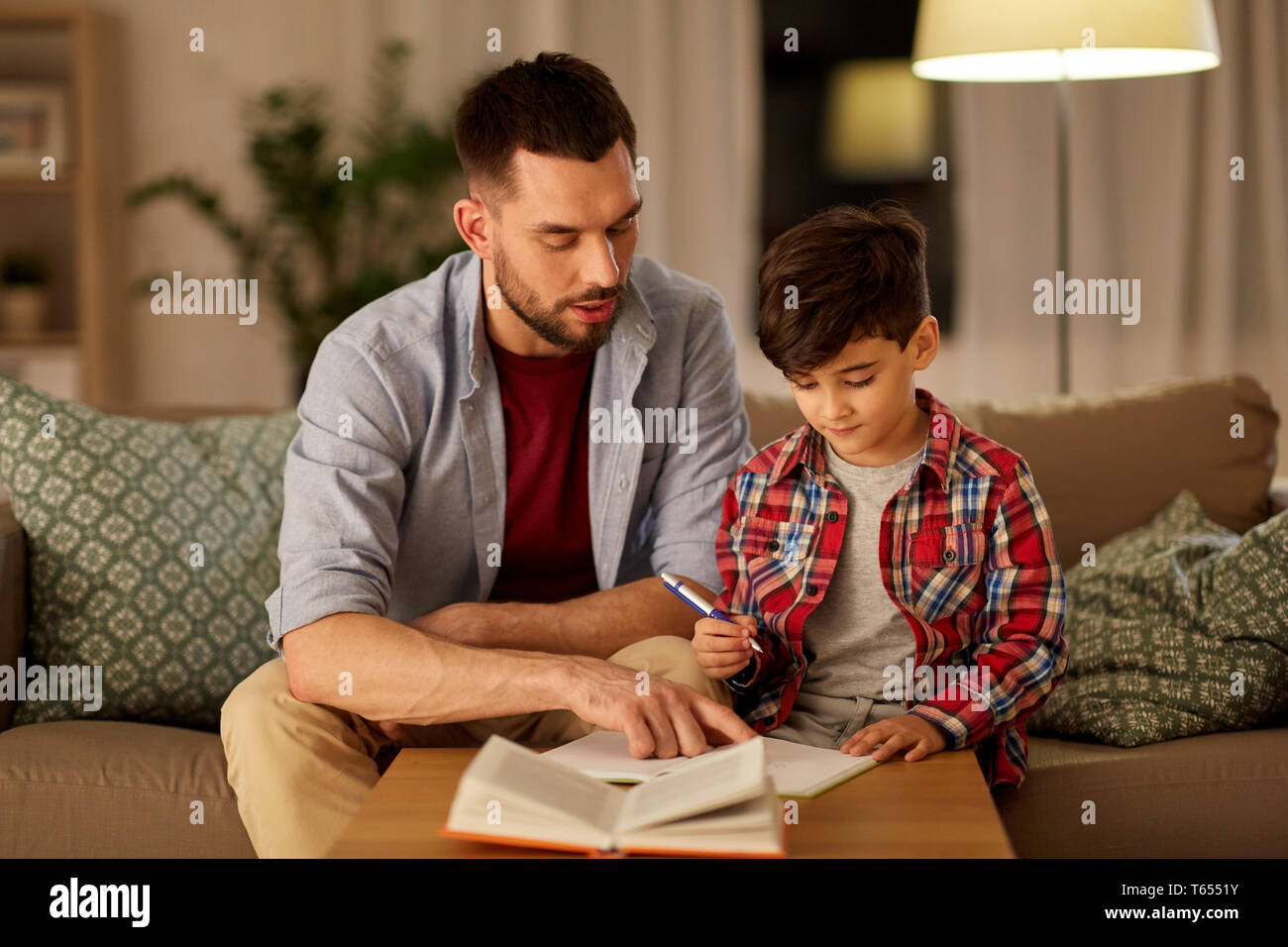 father and son doing homework together Stock Photo - Alamy
