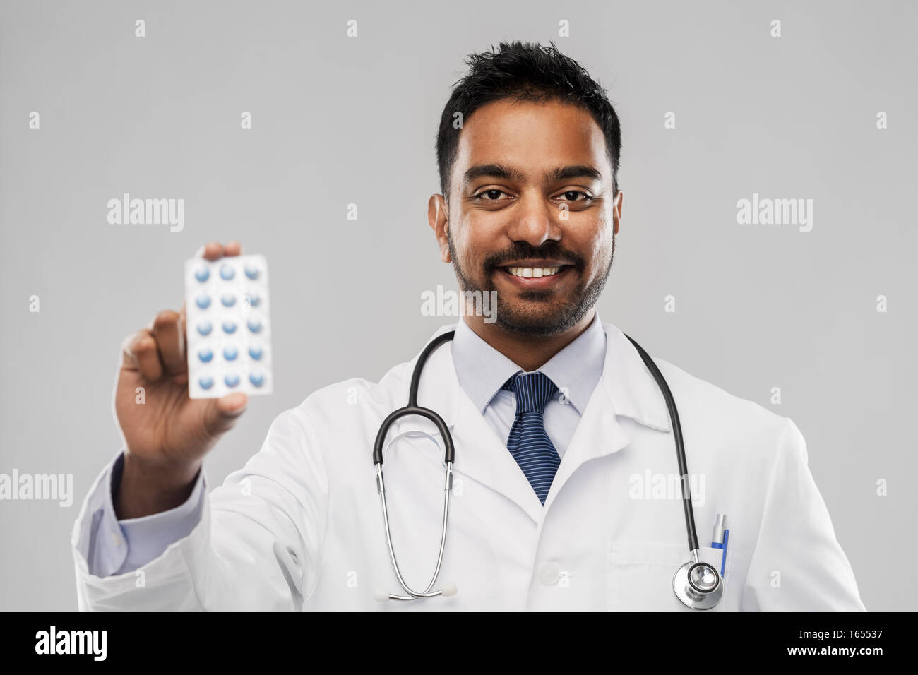 indian male doctor with pills and stethoscope Stock Photo - Alamy