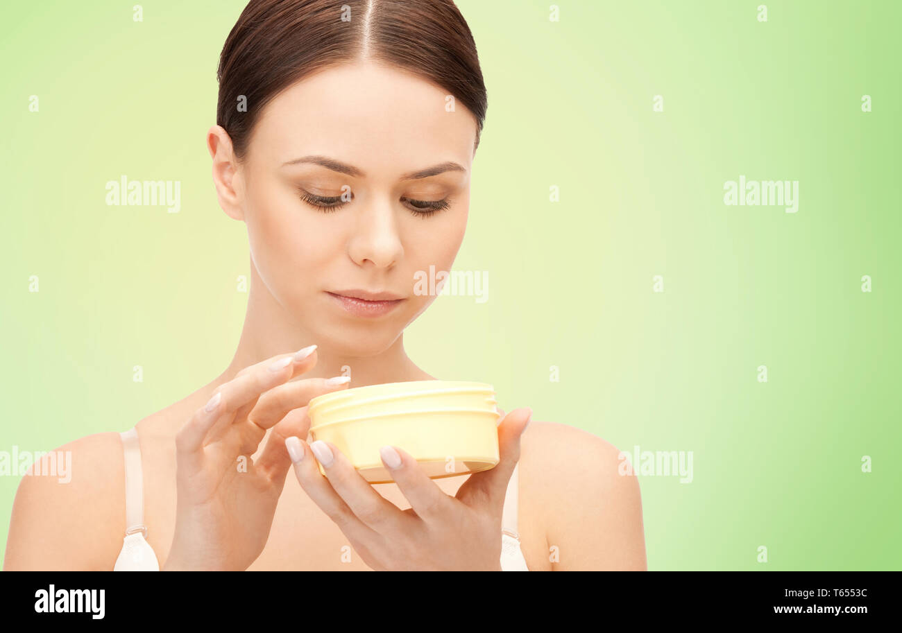 beautiful woman with moisturizing cream Stock Photo - Alamy