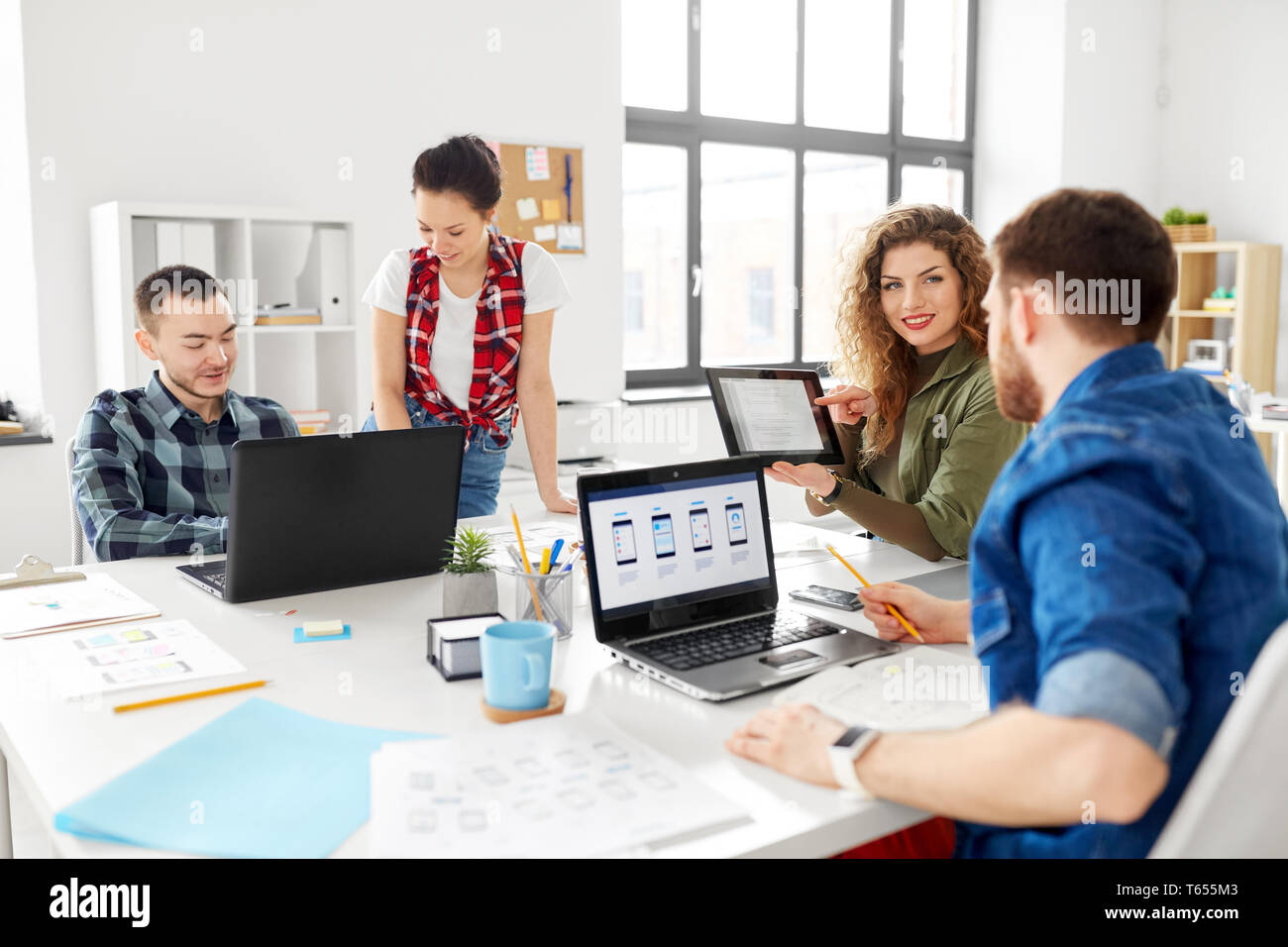 creative team working on user interface at office Stock Photo - Alamy