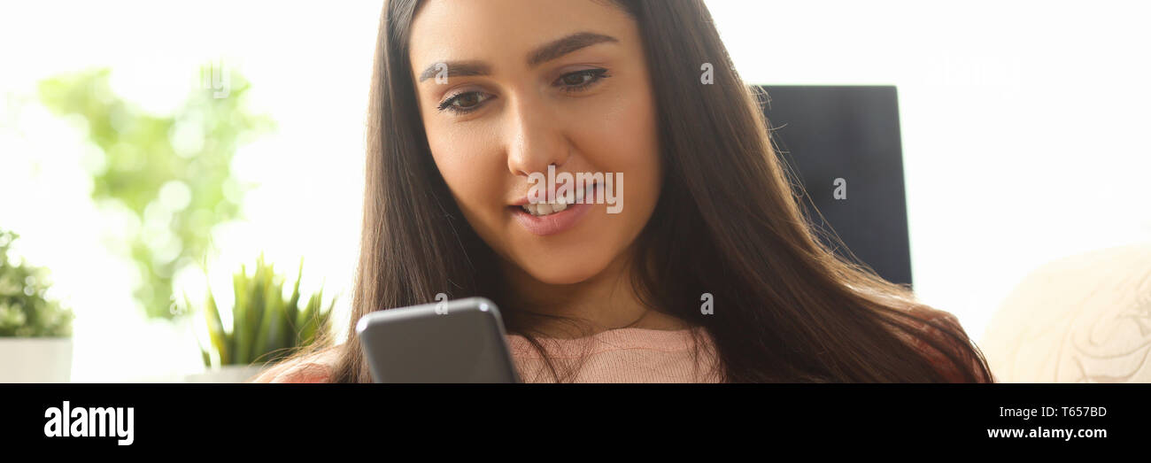 Young beautiful woman look camera holds Stock Photo - Alamy