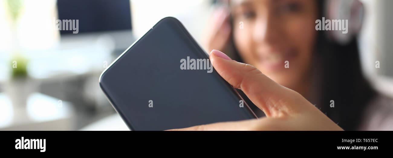 Young beautiful woman look camera holds Stock Photo - Alamy