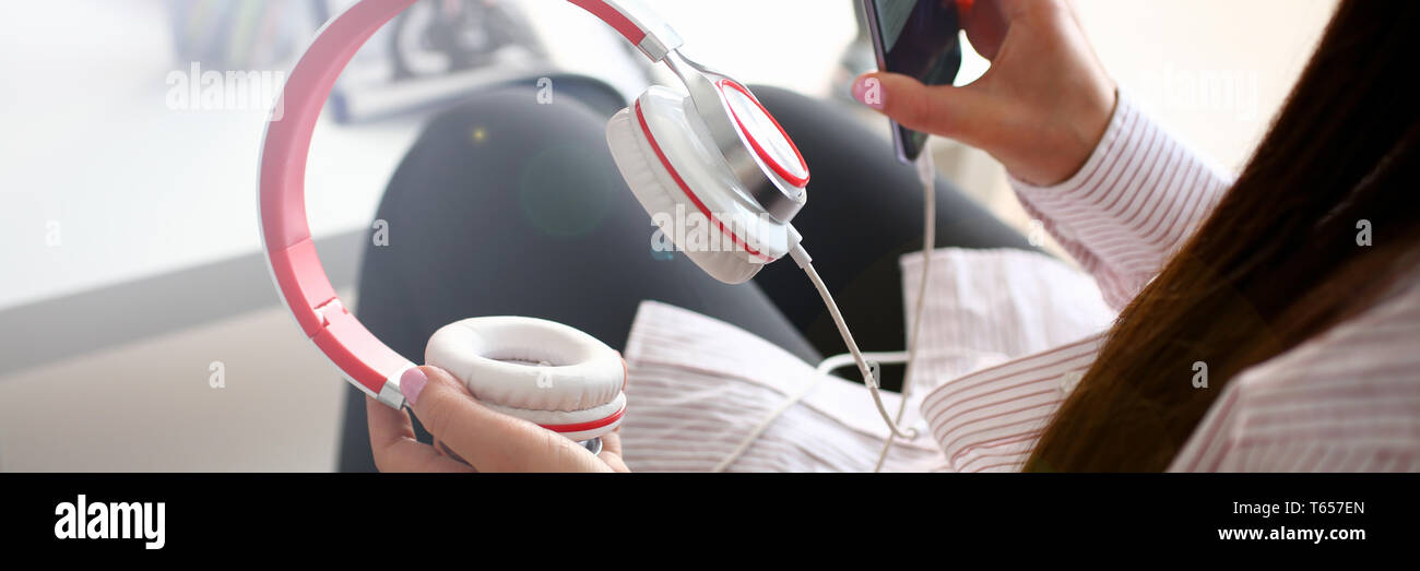 Young beautiful woman look camera holds Stock Photo - Alamy