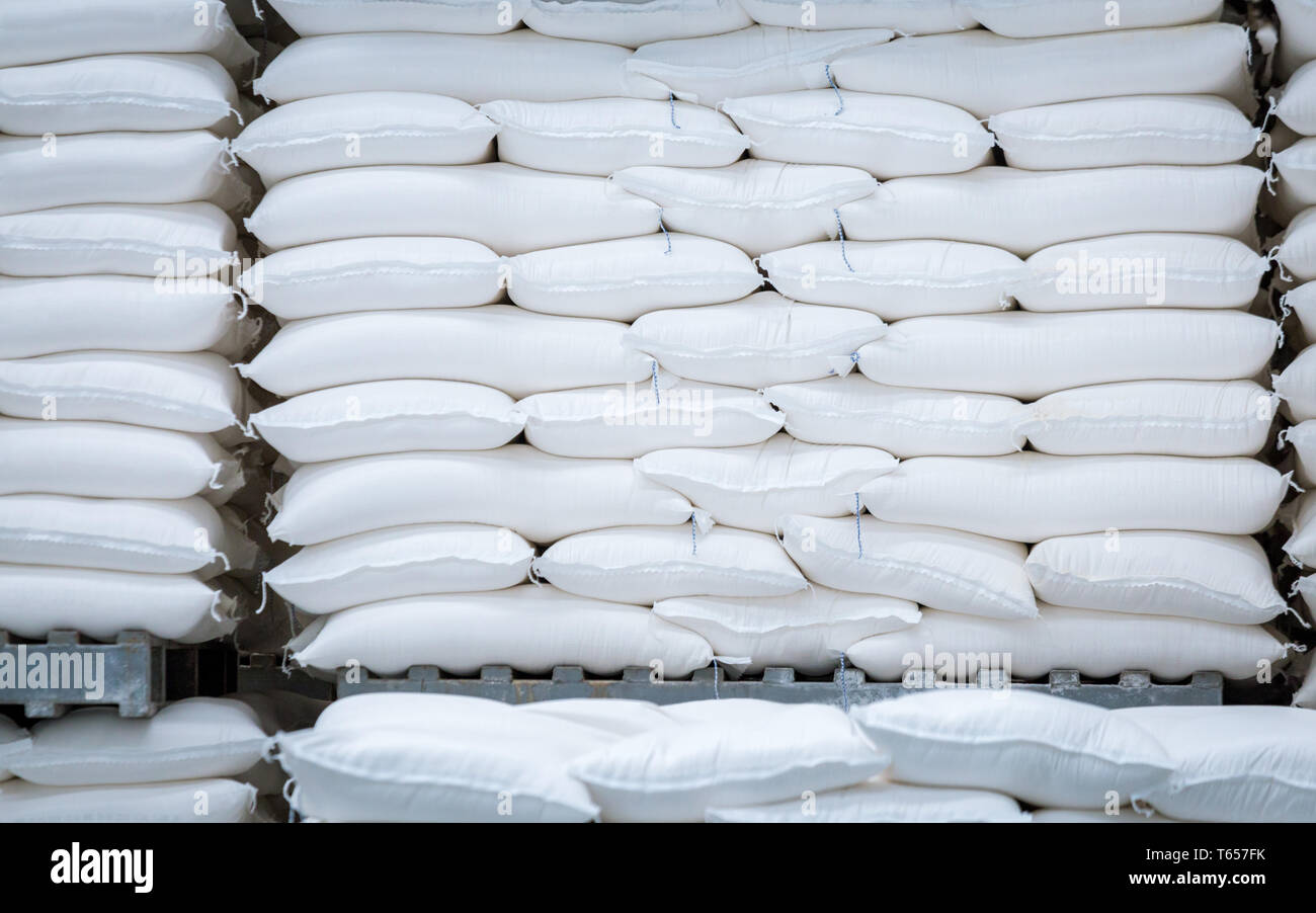 stack of white bag in the warehouse Stock Photo - Alamy