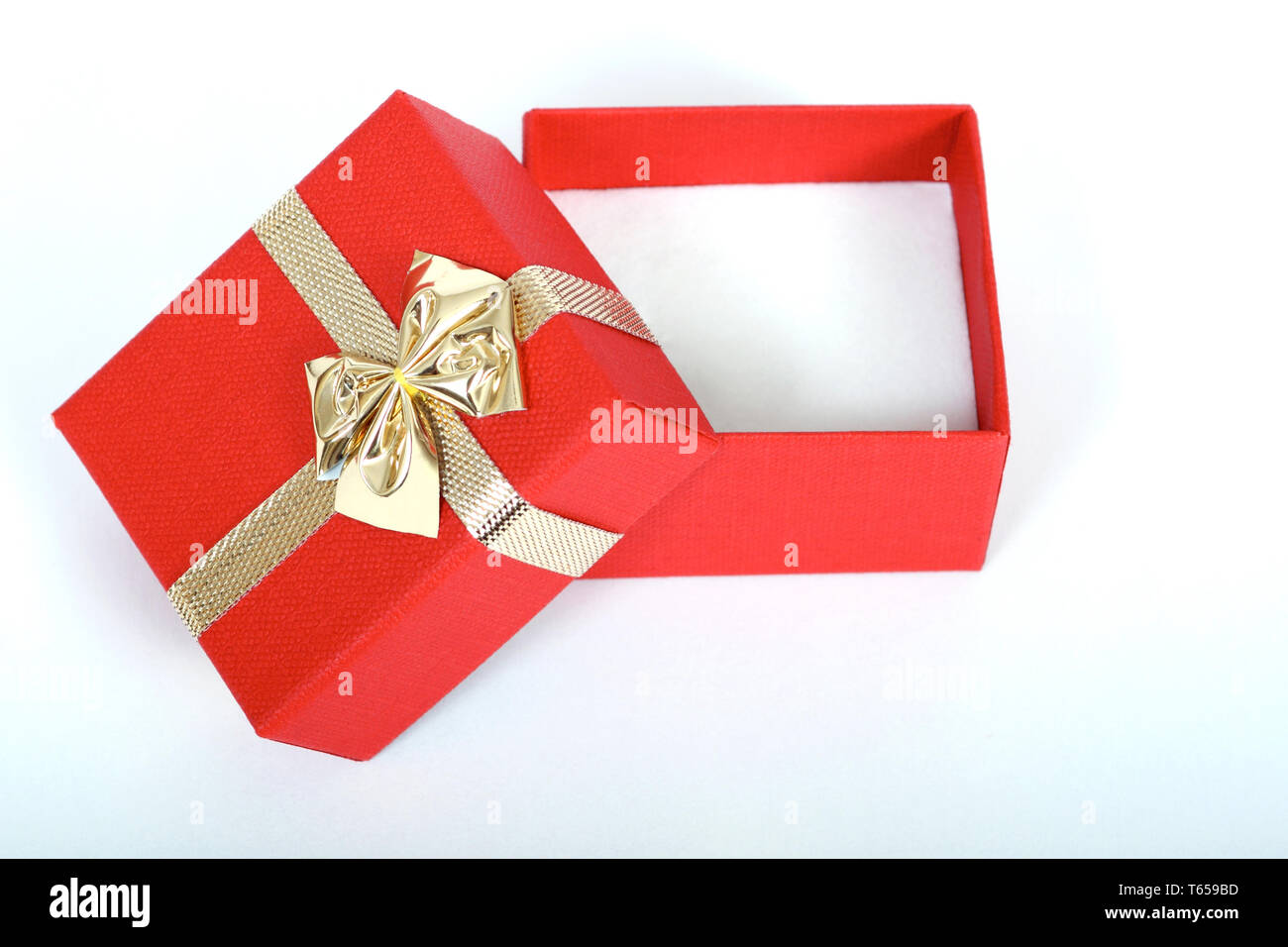 red present box with gold ribbon isolated on white background Stock ...