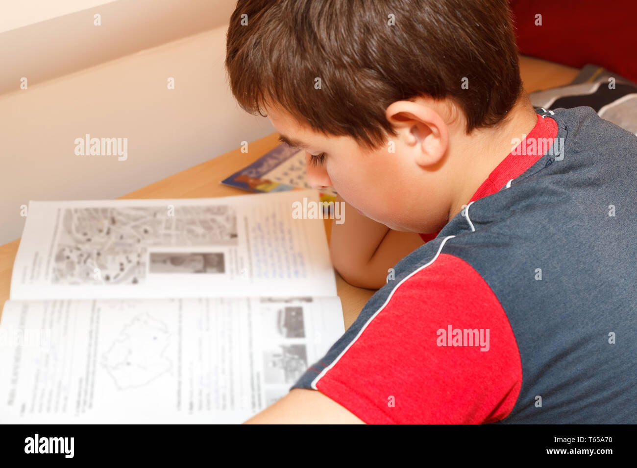 boy doing homework Stock Photo - Alamy