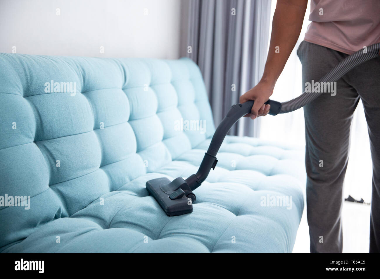 Man using vacuum cleaner hi-res stock photography and images - Alamy