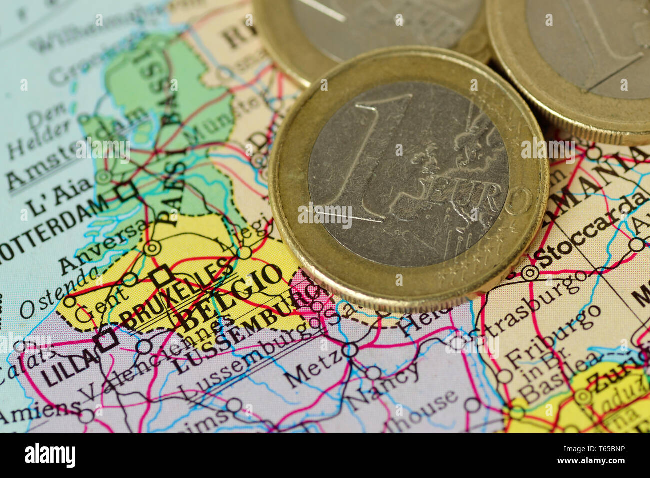 Close-up of Euro coins on europe map Stock Photo - Alamy