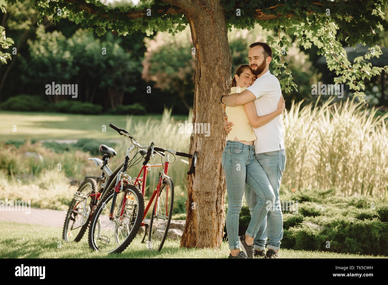 Couple in love hugging on summer nature background Stock Photo - Alamy