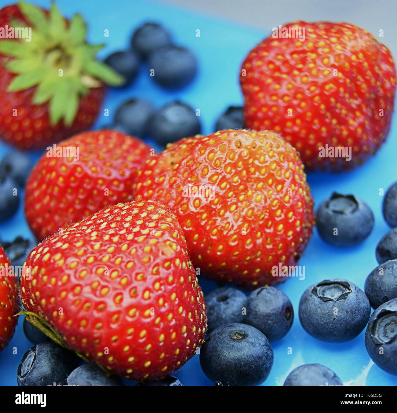 Strawberries and blueberries Stock Photo - Alamy