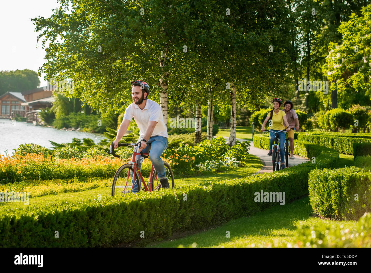 Friends riding bikes together on hi-res stock photography and images ...
