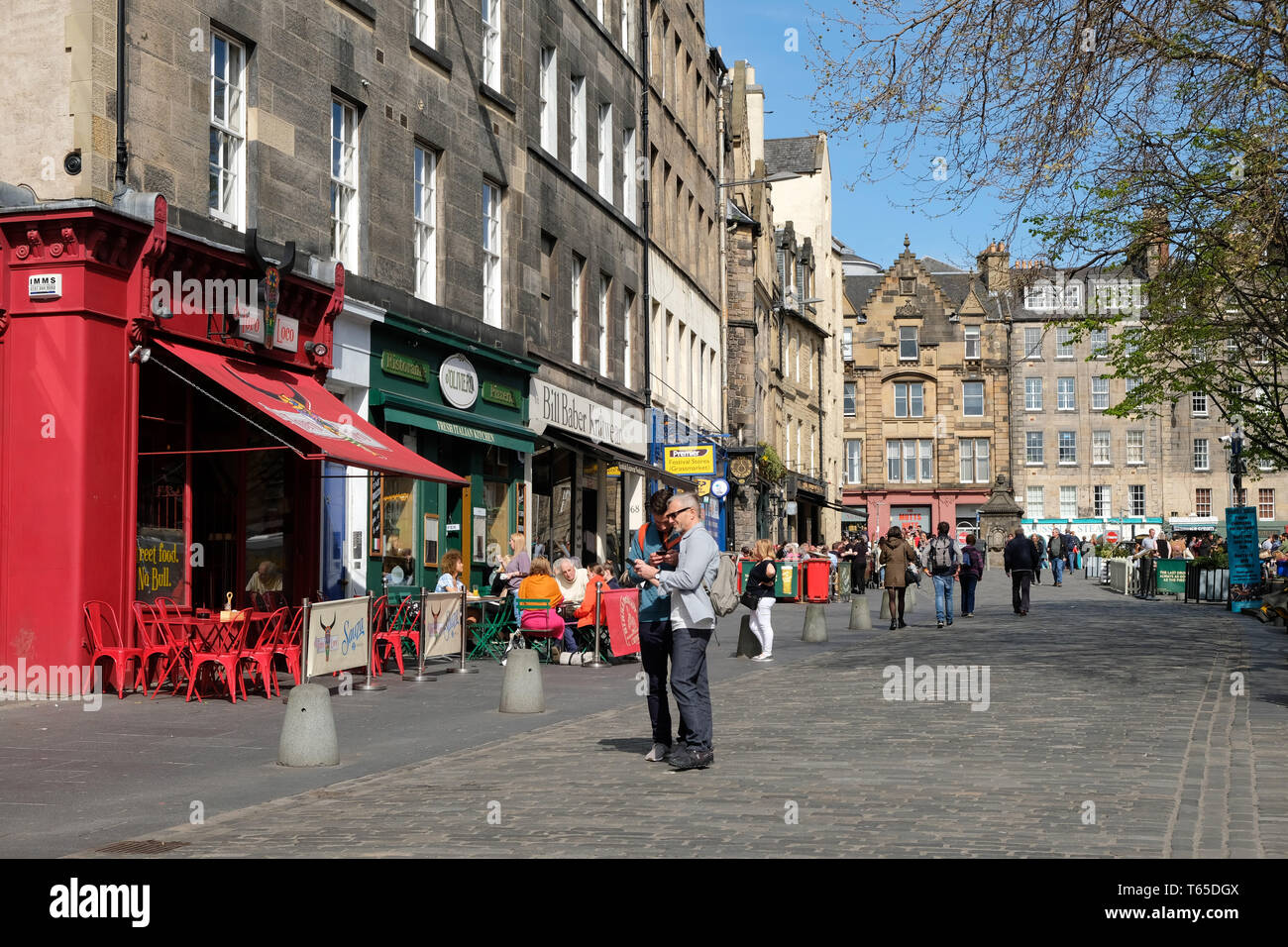 Tourists, pubs and bars on Grassmarket in the Old Town, Edinburgh ...