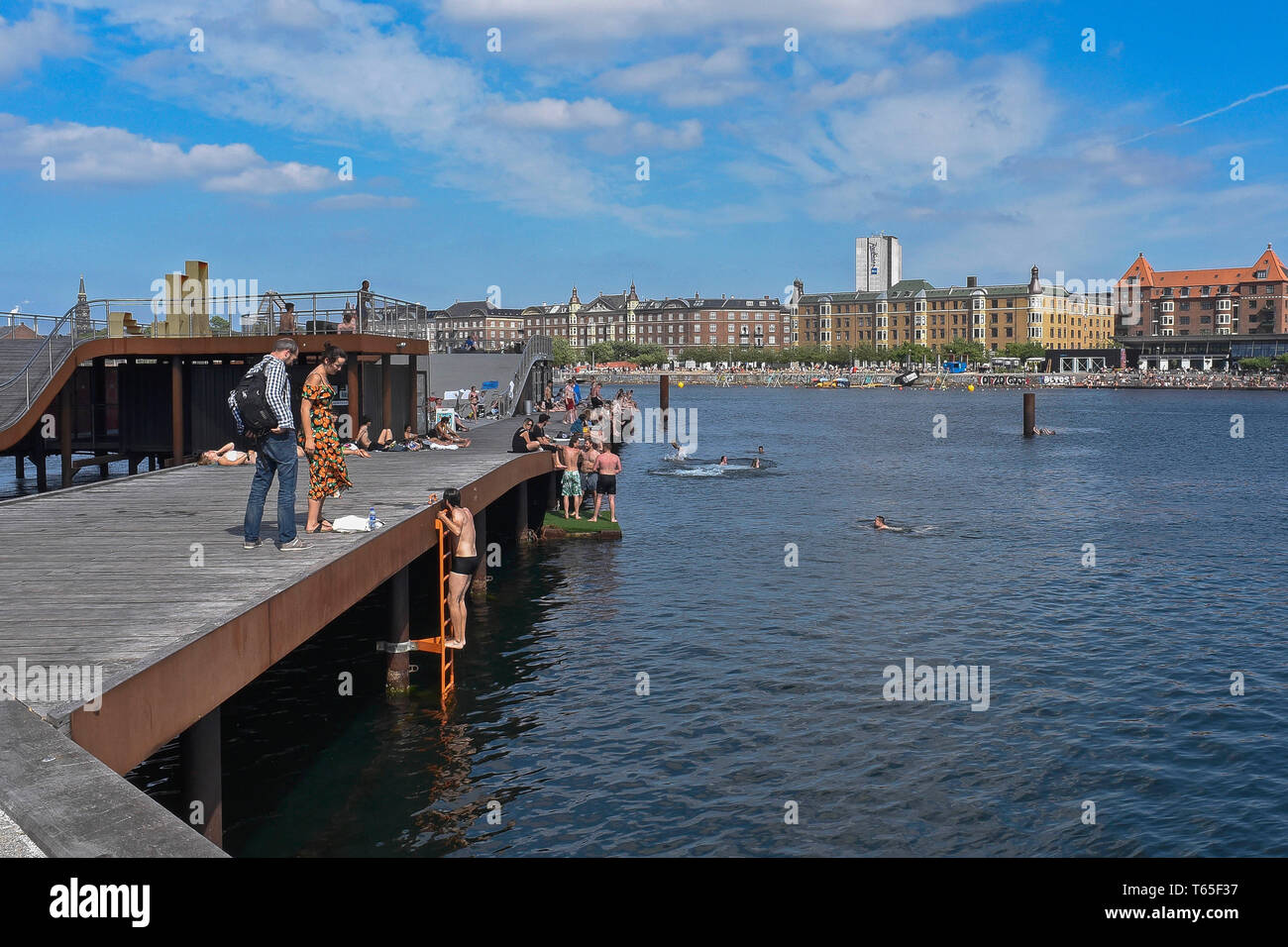 Tourists and visitors enjoy a warm and sunny summer day in the Islands ...