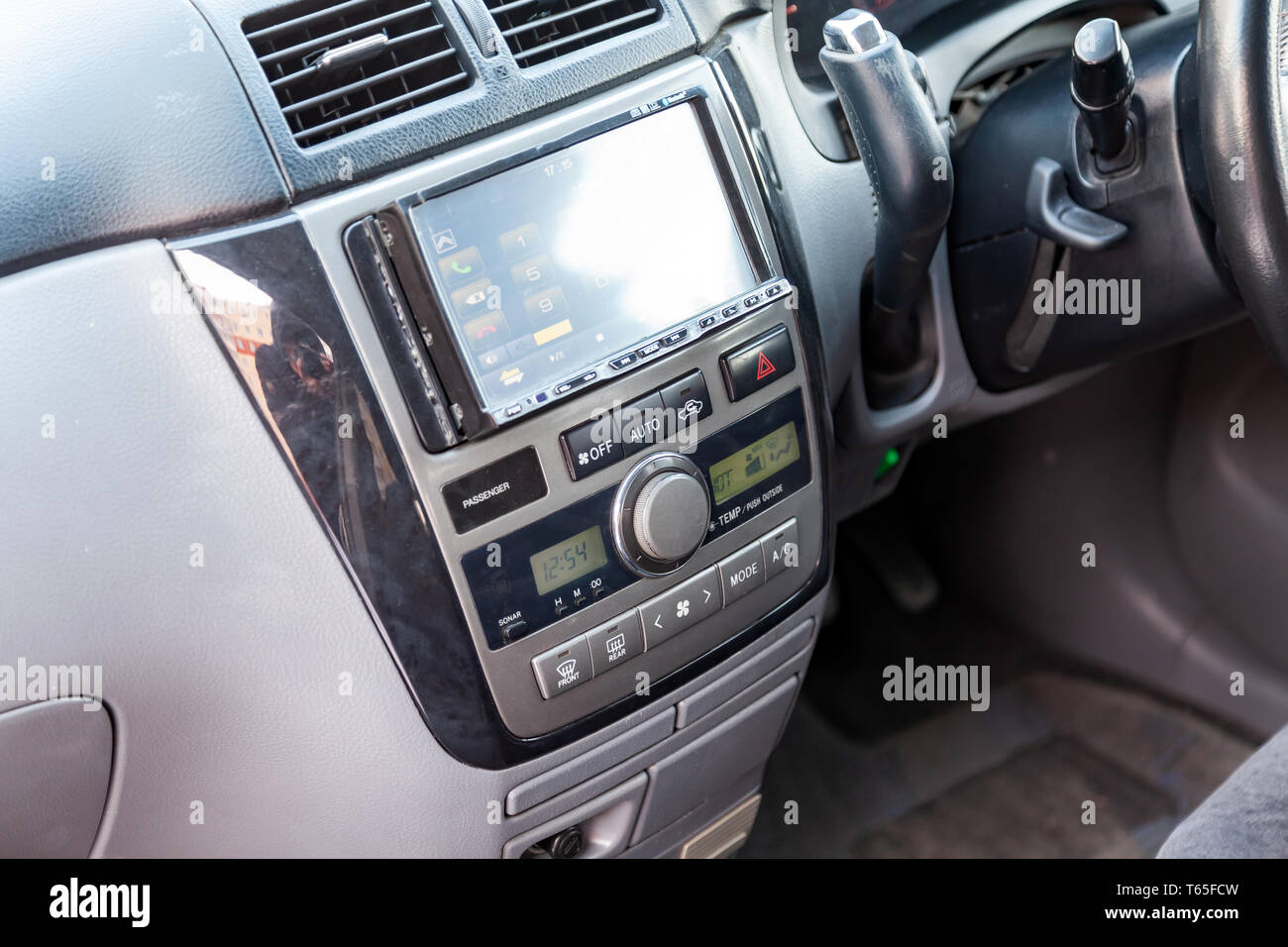 The central control console on the panel inside the car close-up with ...
