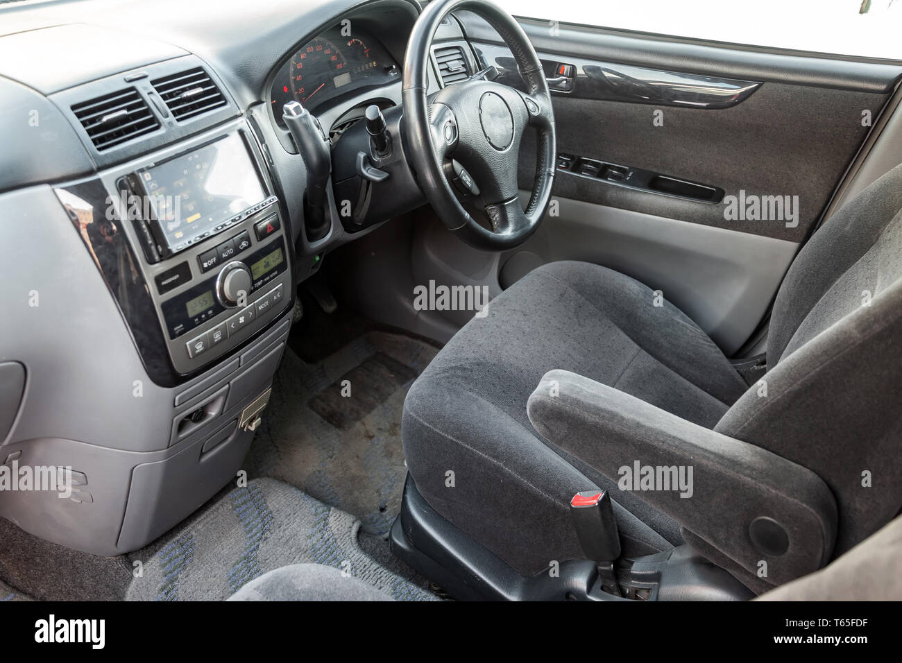 View to the black color interior of suv car with front seats, steering ...