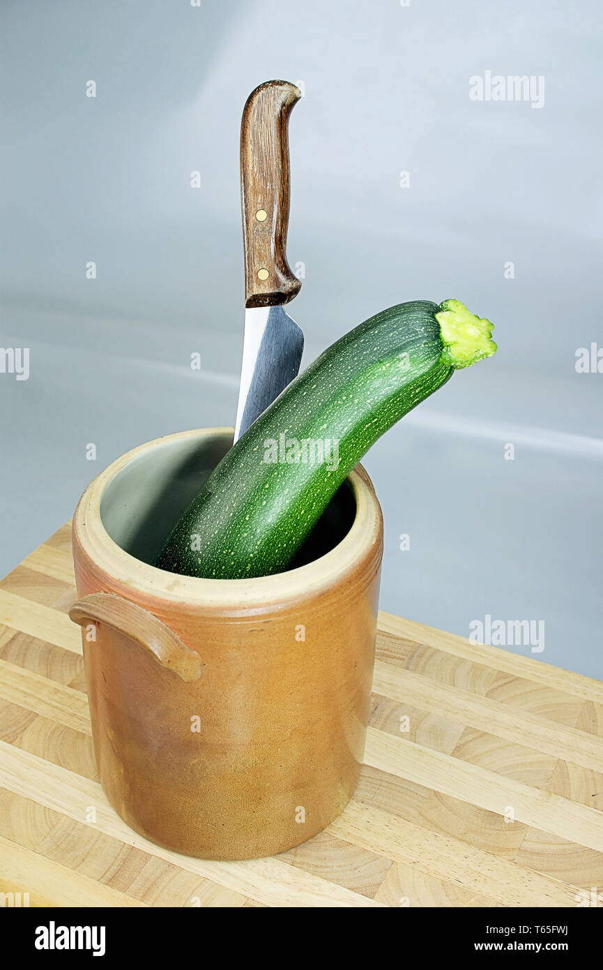 Zucchini and kitchen knife Stock Photo - Alamy