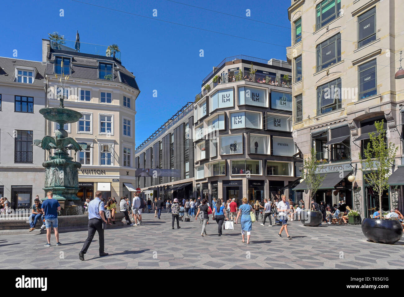People walking through Amagertorv or Amager Square, a central square in ...