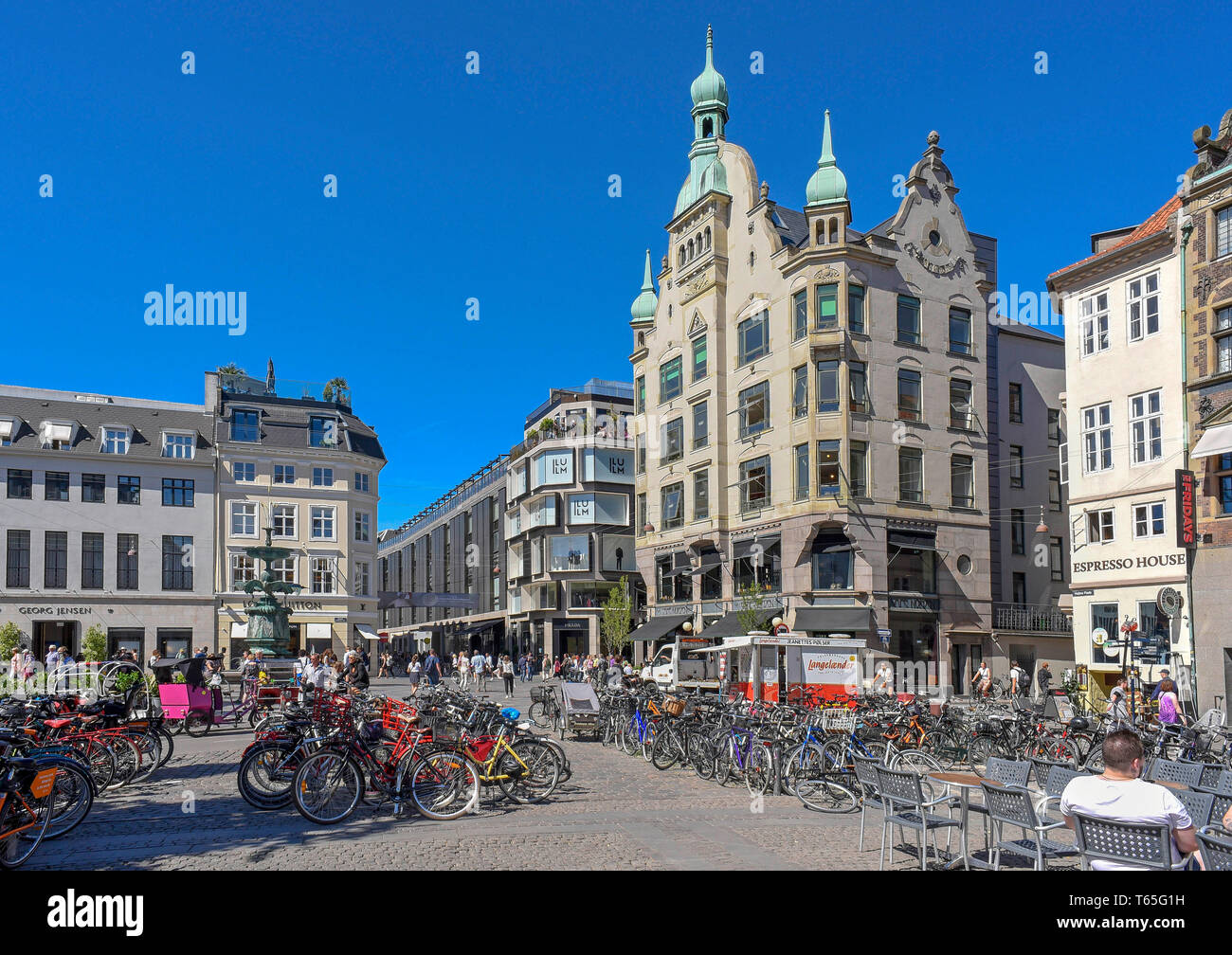 People walking through Amagertorv or Amager Square, a central square in ...